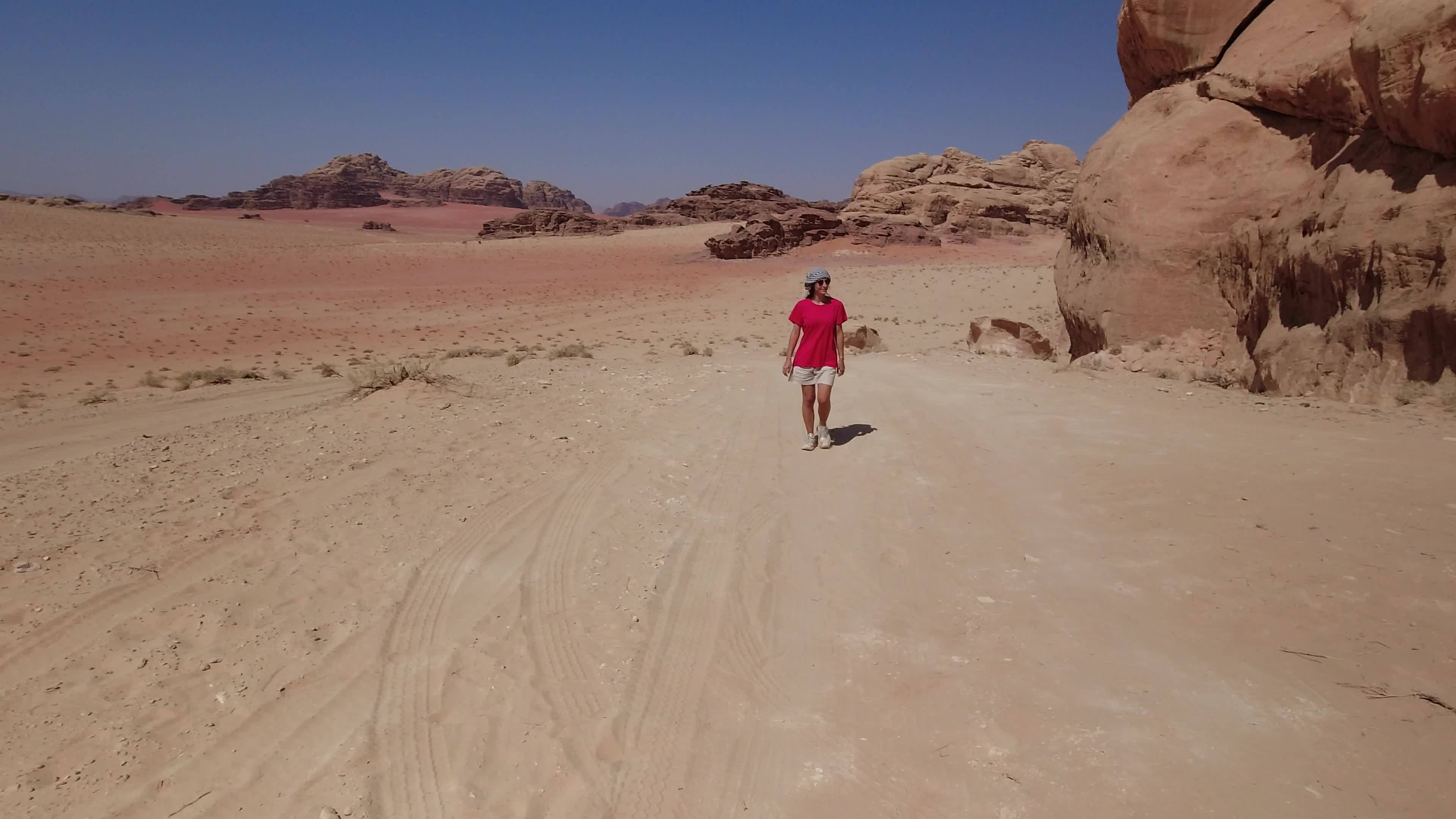 Fast motion time lapse Woman tourist hiker walk explore wadi rum desert ... Fast motion time lapse Woman tourist hiker walk explore wadi rum desert ...