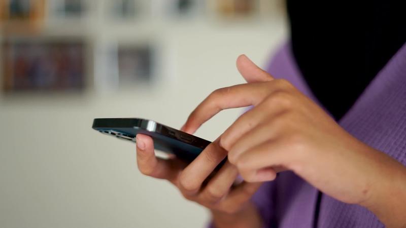 Business woman scrolling smartphone from side 20257530 Stock Video at Vecteezy