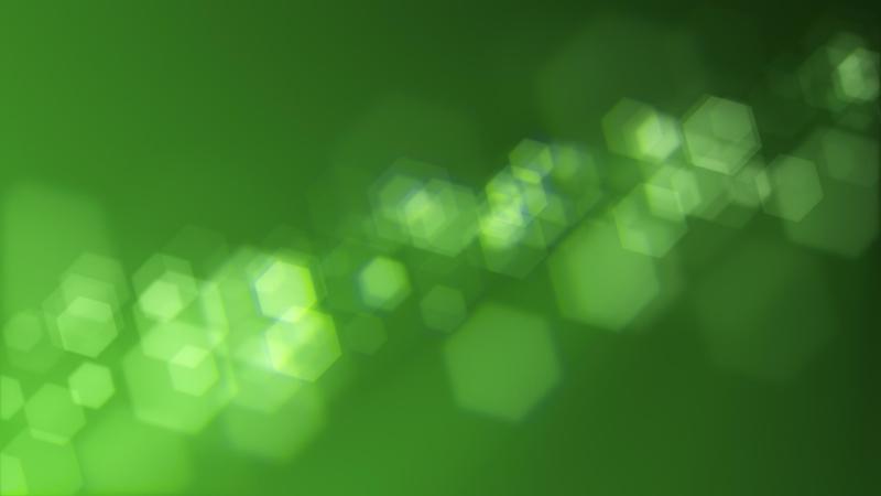 Defocused green bokeh lights background. This elegant motion animation with hexagonal bokeh ...