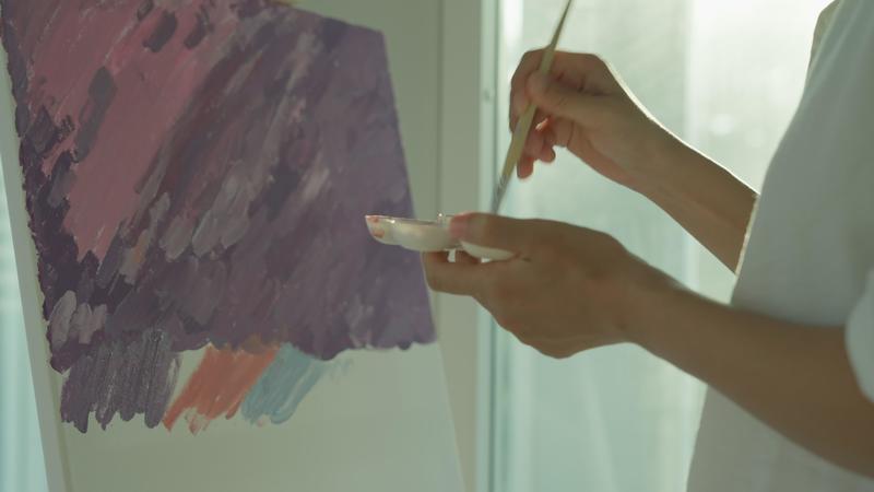 Professional female artist girl use paintbrush in abstract art for ... Professional female artist girl use paintbrush in abstract art for ...