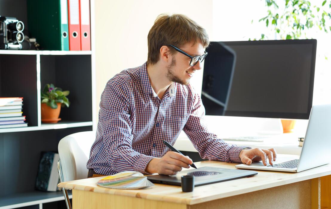 Man Working On Desk Stock Photos, Images and Backgrounds for Free Download