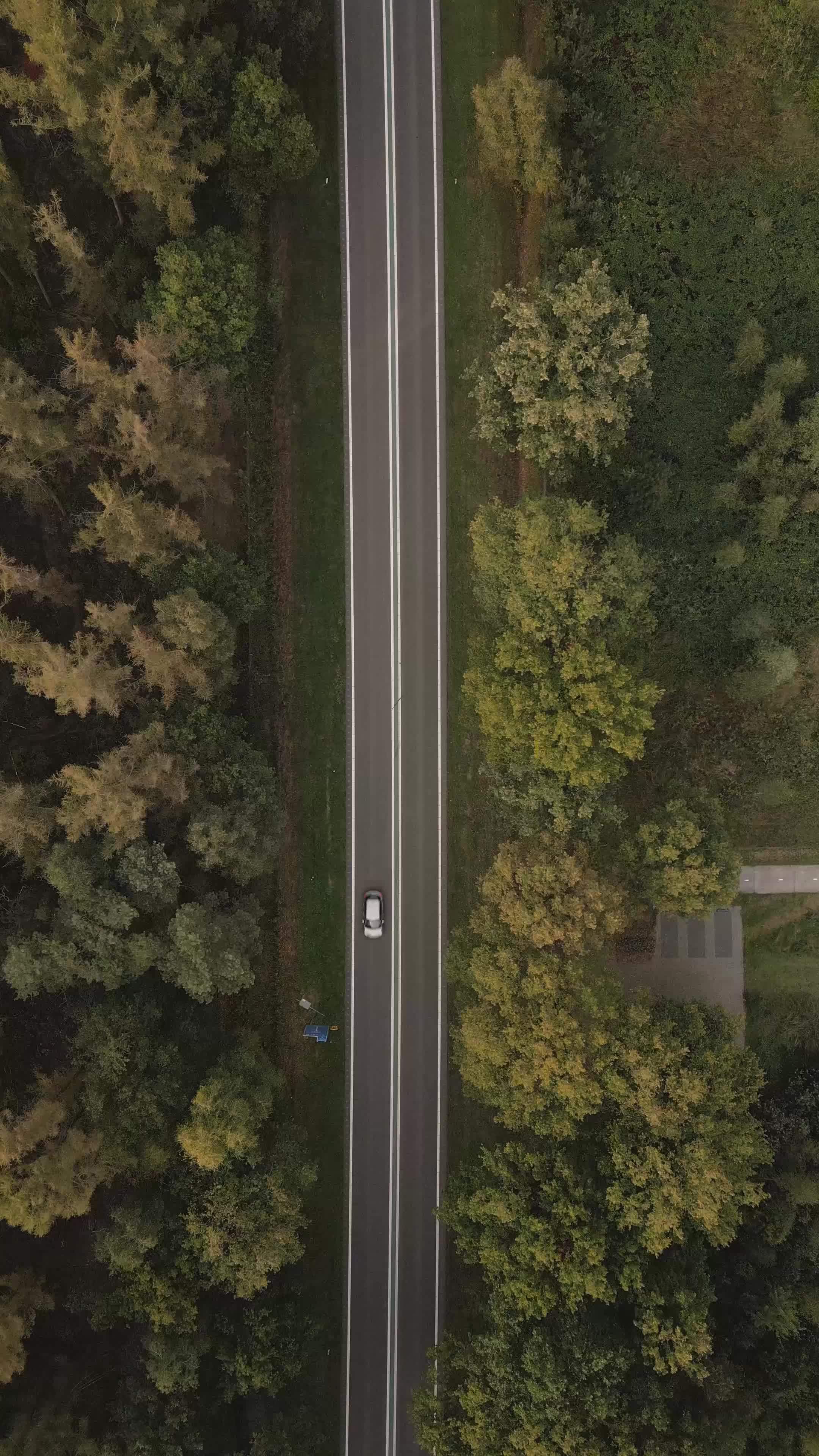 Aerial view of parallel highway roads in a grassy landscape 21256530 ...