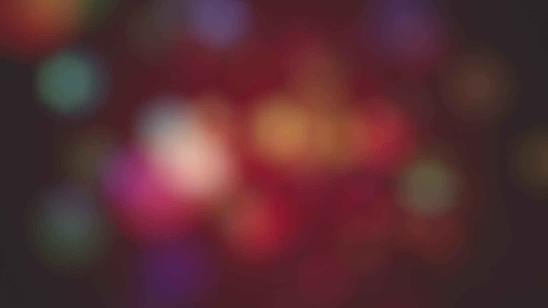 Gently moving multi-coloured festive bokeh light particles motion background animation. Full HD ...