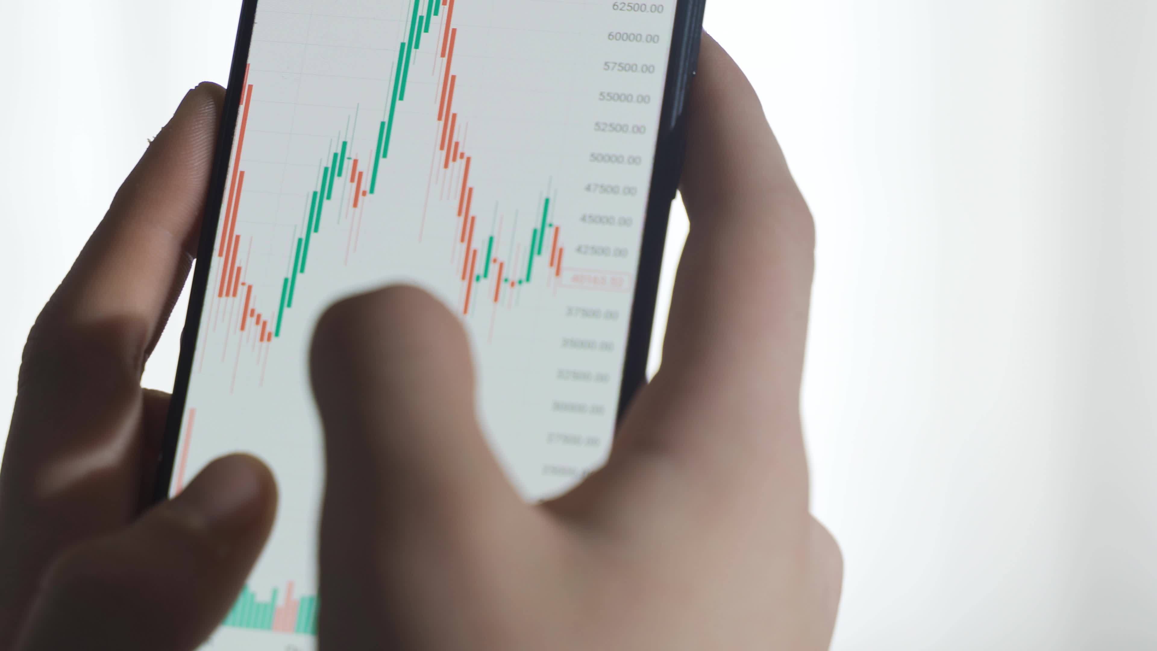 Close Up Of Man Looking At Stock Market Stock Investment Charts From