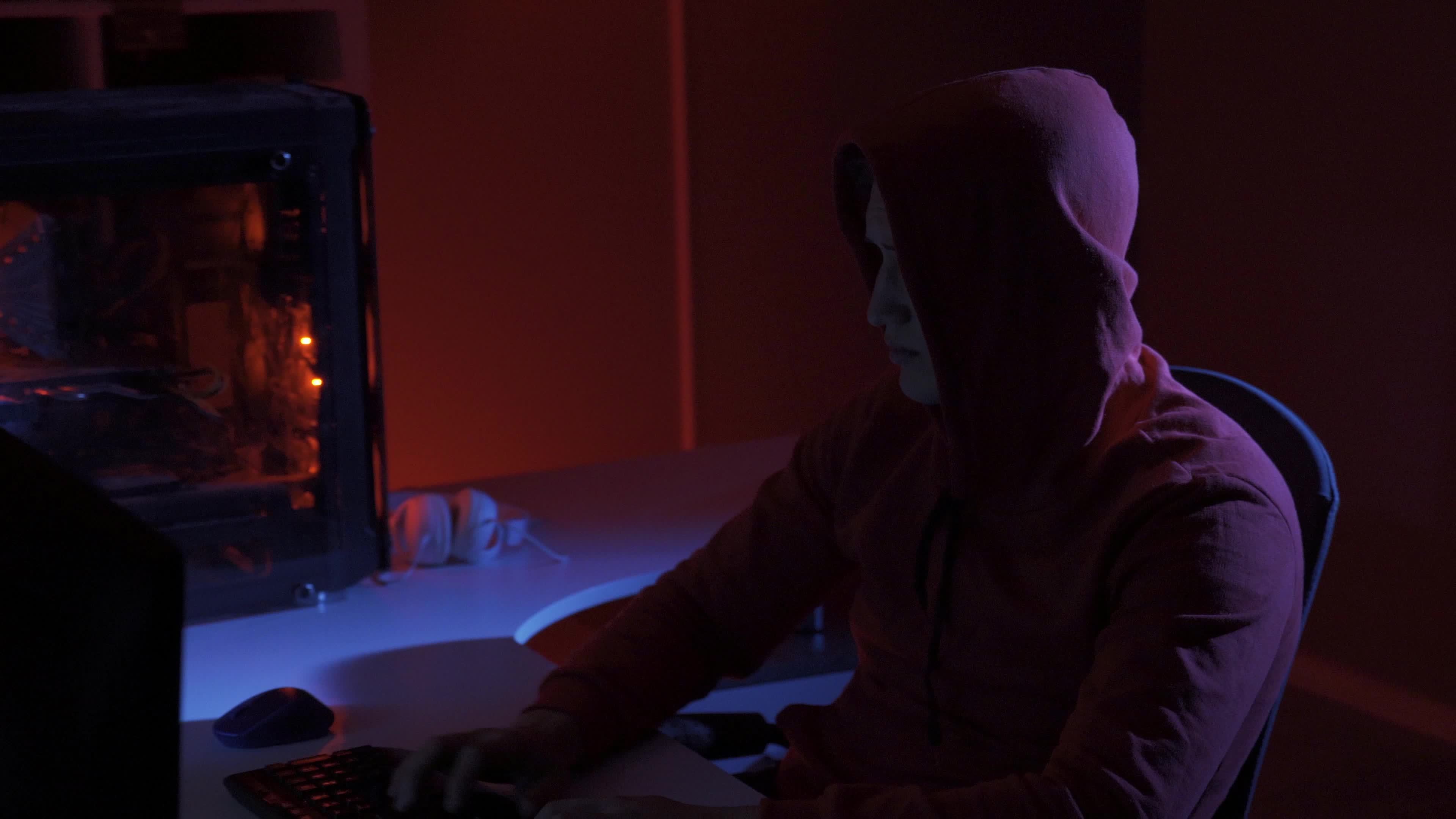 Hacker Man Side View Of Hacker Sitting Near Computer Monitors With Green Code Screens 21379188