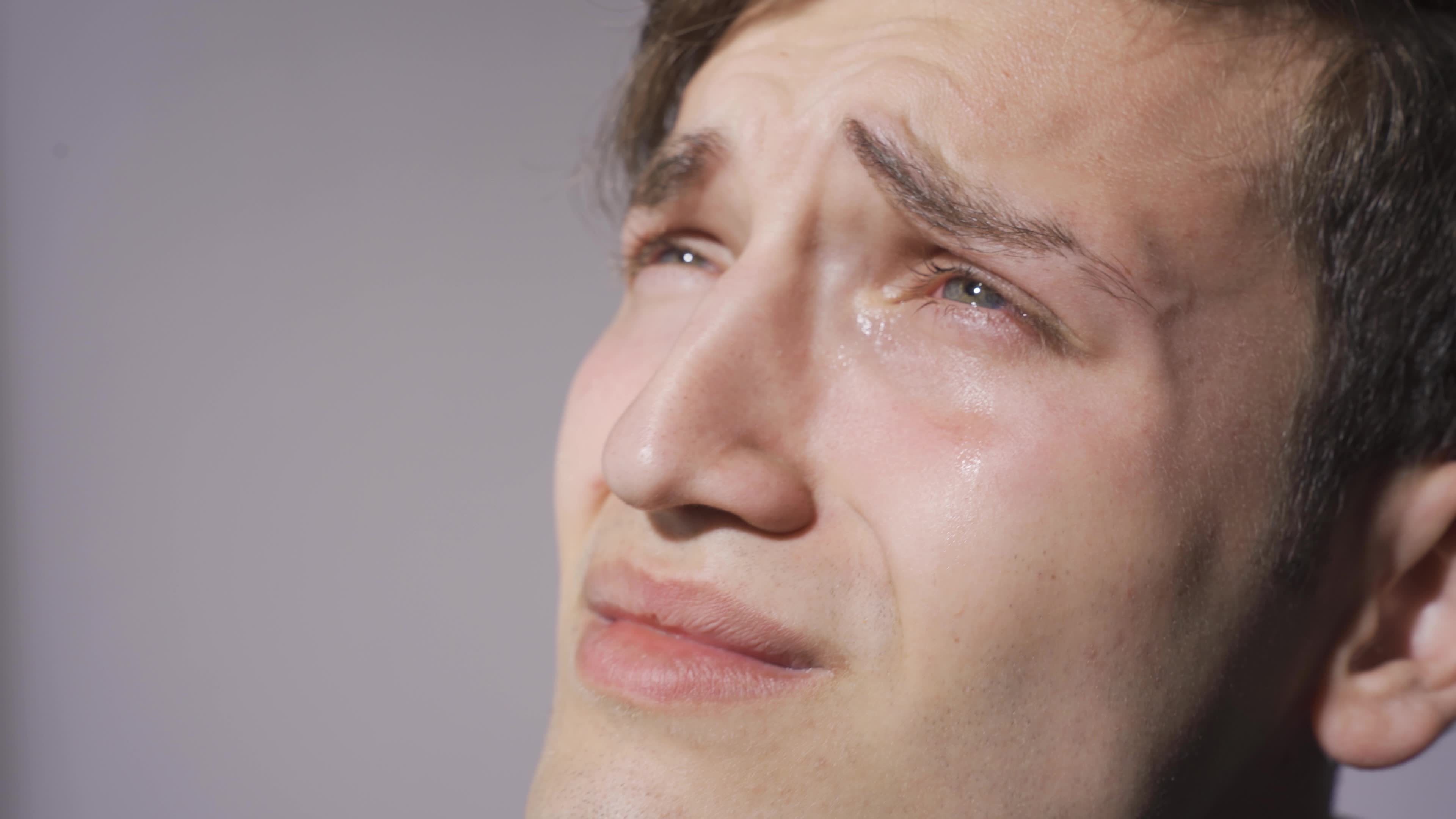 Depressed young handsome man crying. Unhappy man is sad and crying. 21413280 Stock Video at Vecteezy