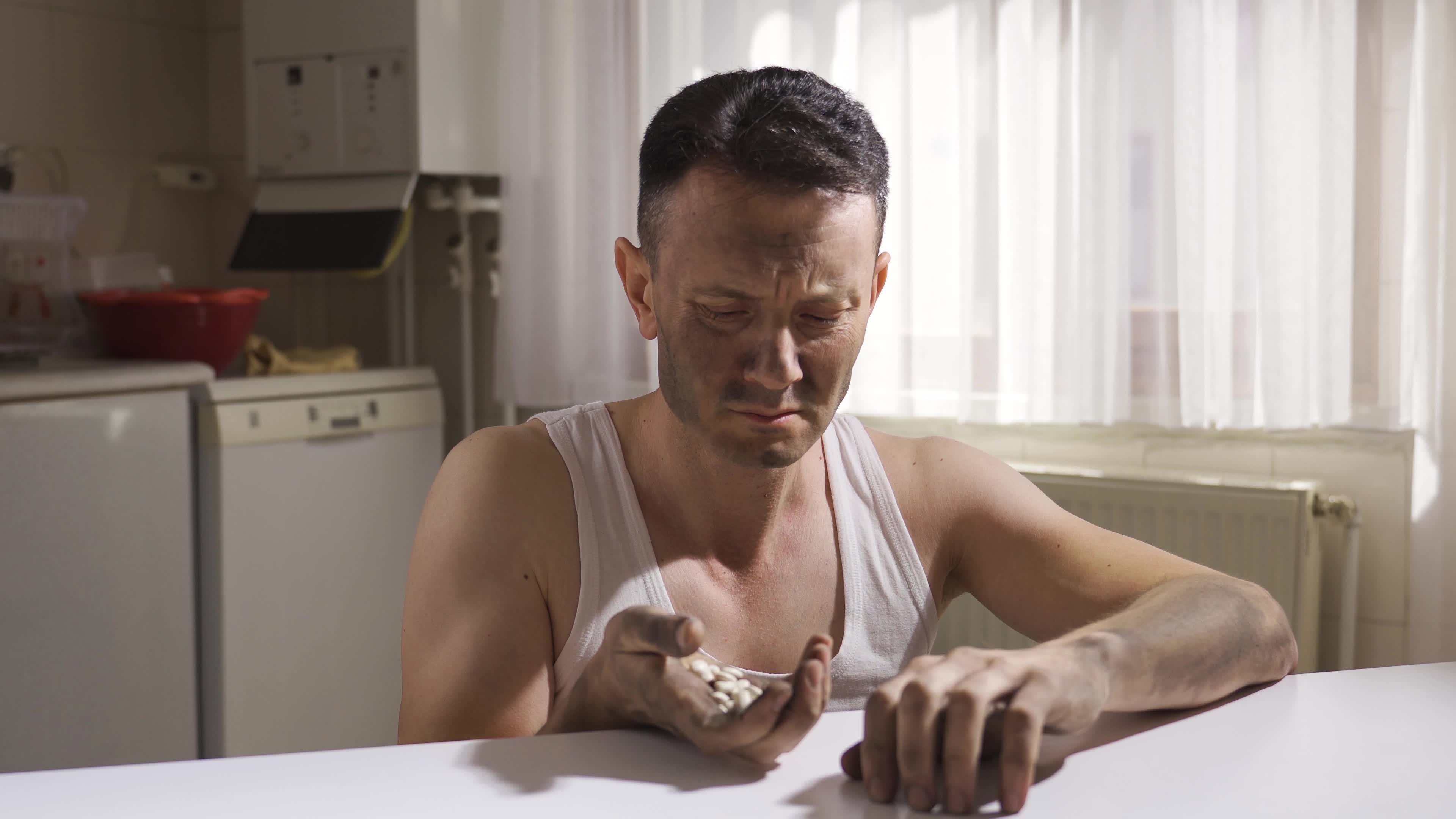 The poor and hungry man is experiencing food shortages. Poverty and hunger crisis. The poor man ...