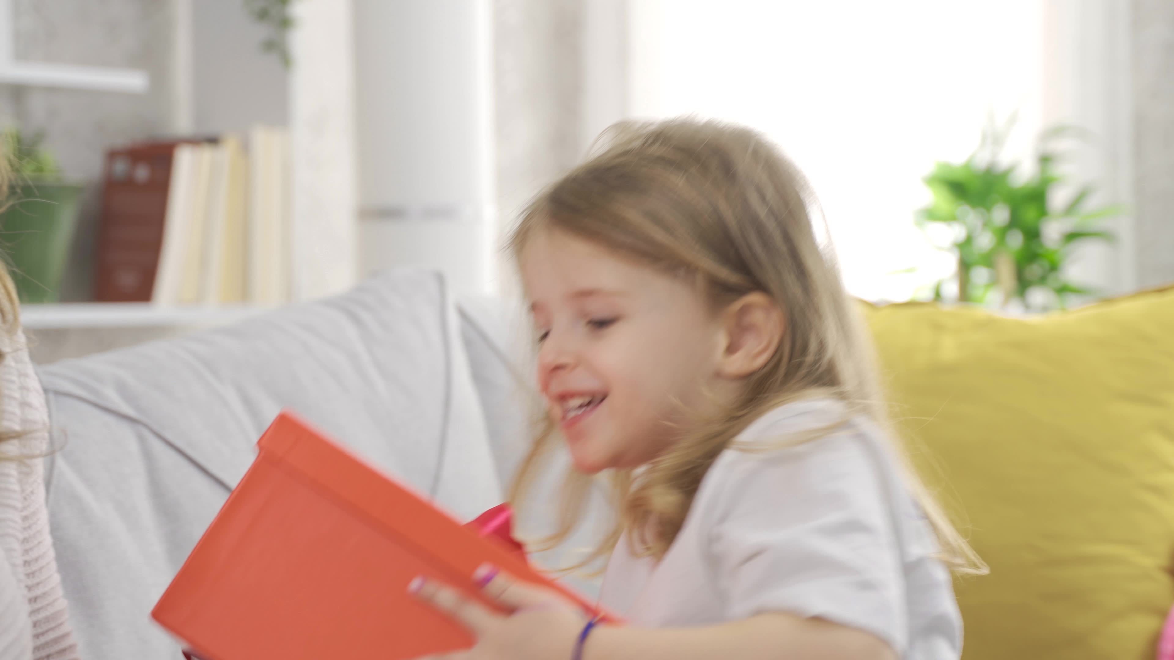 Little girl giving a present to her mother. Little girl giving gift box ... Little girl giving a present to her mother. Little girl giving gift box ...