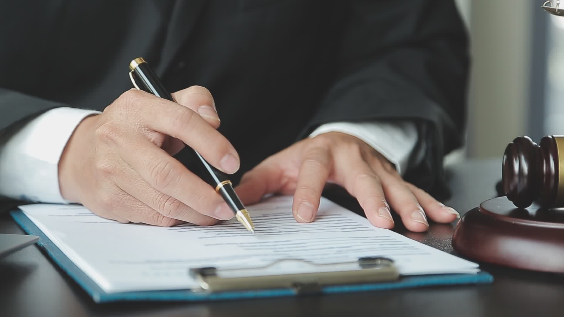 Business and lawyers discussing contract papers with brass scale on desk in office. Law, legal ...