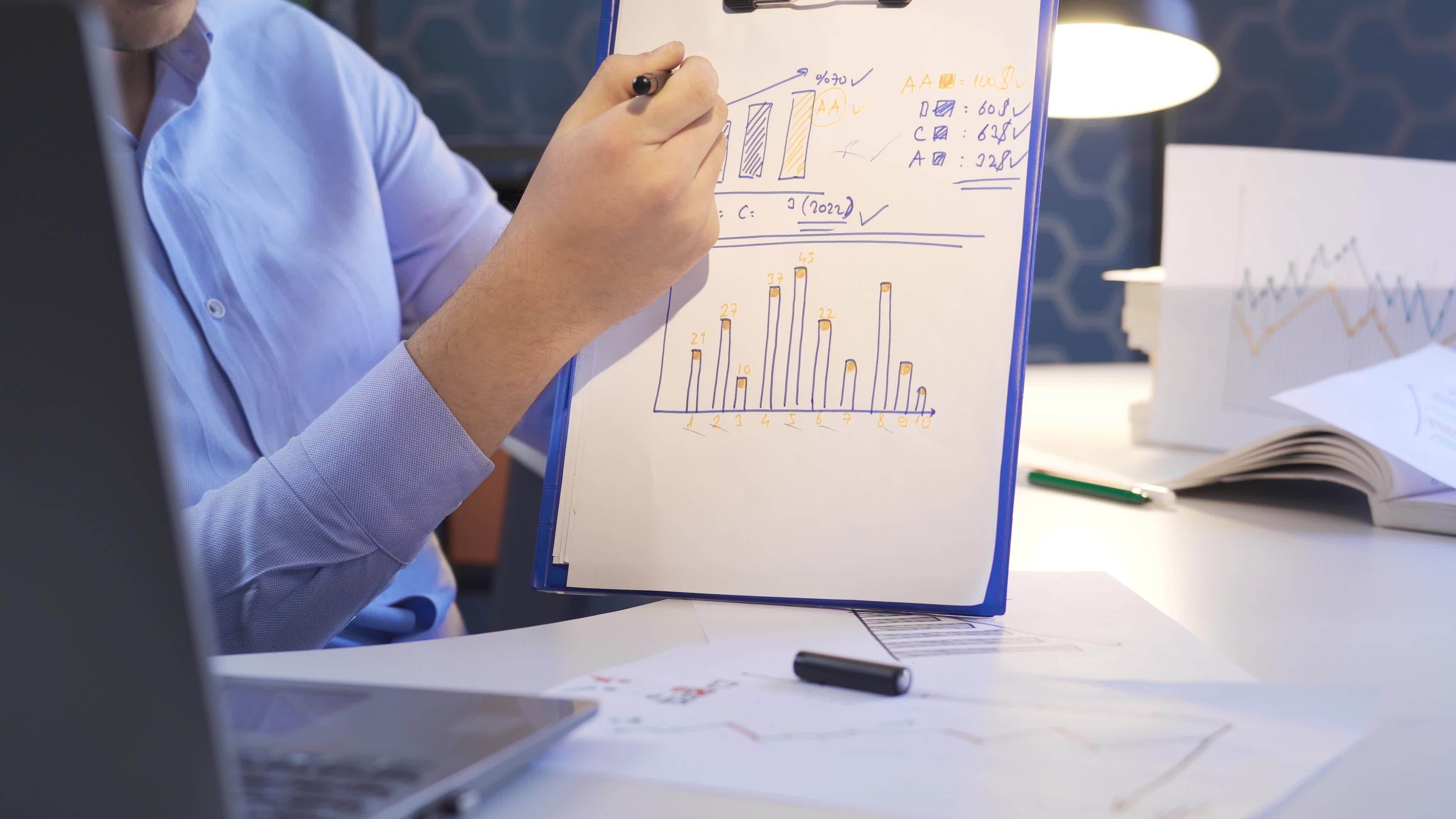 Man Interpreting And Analyzing Financial Charts In Online Meeting Man