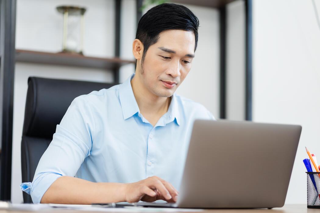 Asian Man Typing Stock Photos, Images and Backgrounds for Free Download