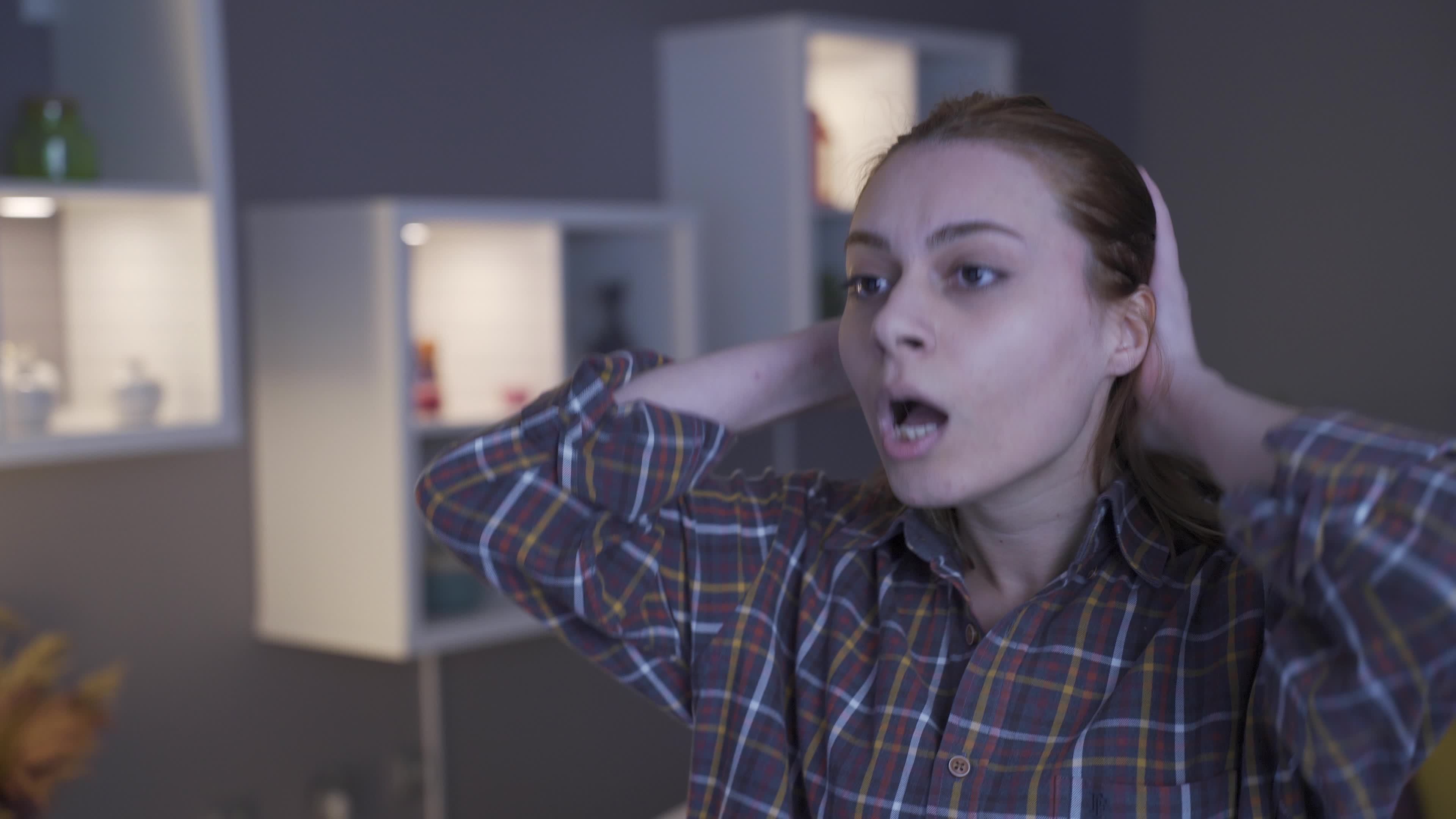 The woman is stressed and angry. The woman who is stressed and angry at home can't stand still ...