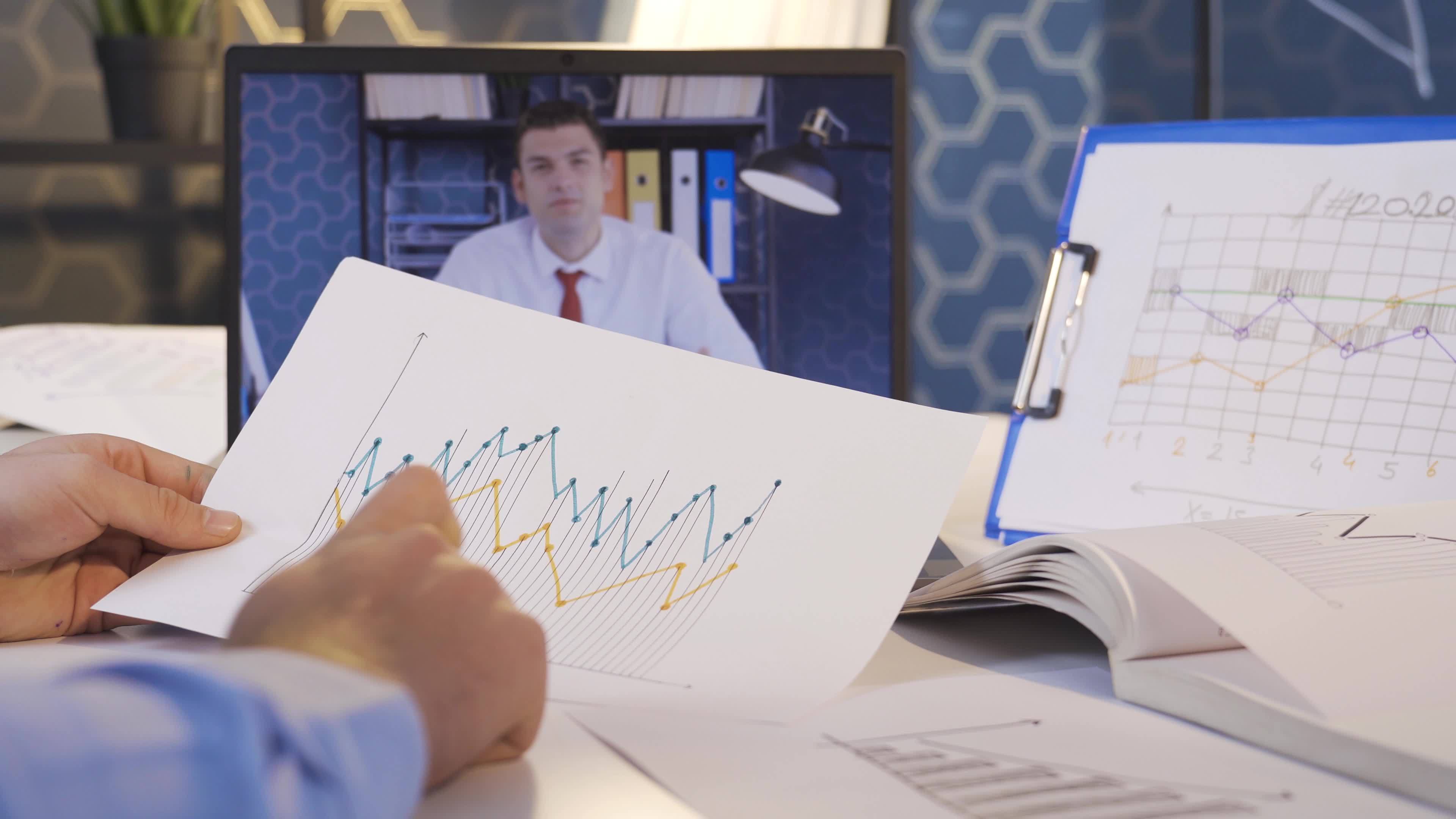 Analyzing Business Charts And Conducting Business Meeting Online Colleagues Analyze Data From