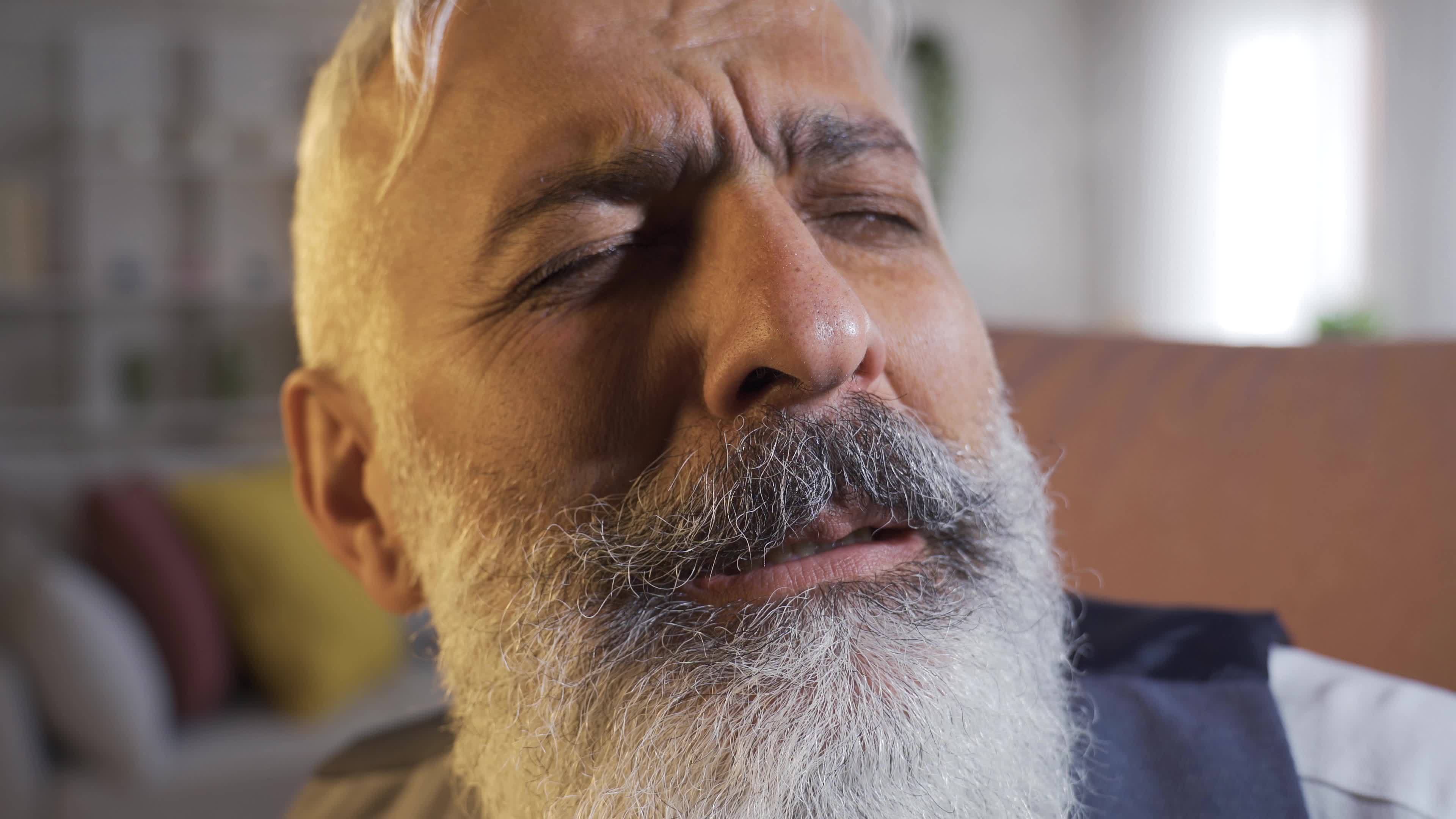 Mature man crying, suffering, crying from anger. The man in the house ...