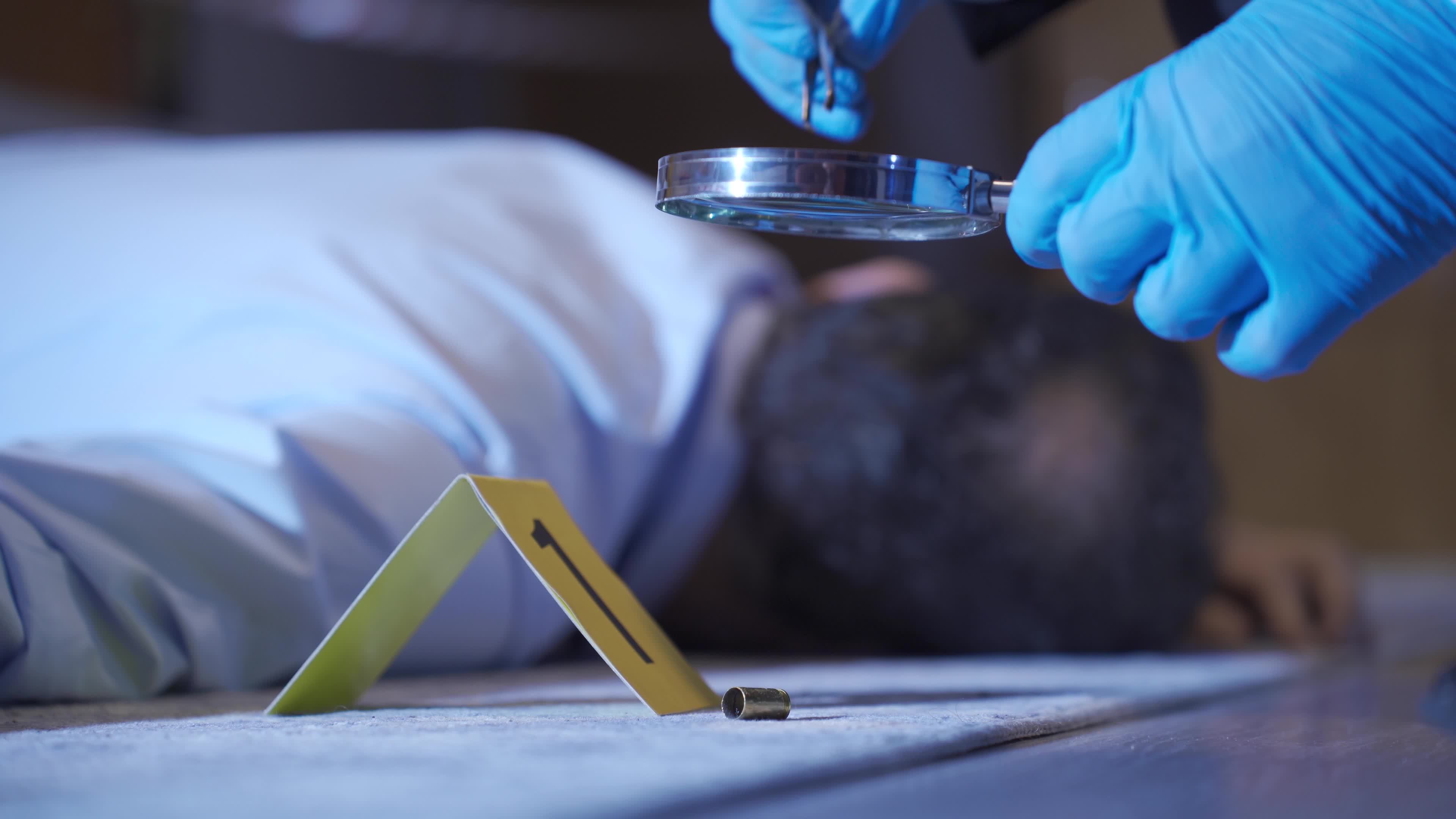 Criminology Forensic Expert Examining Detonated Shell Casings At The