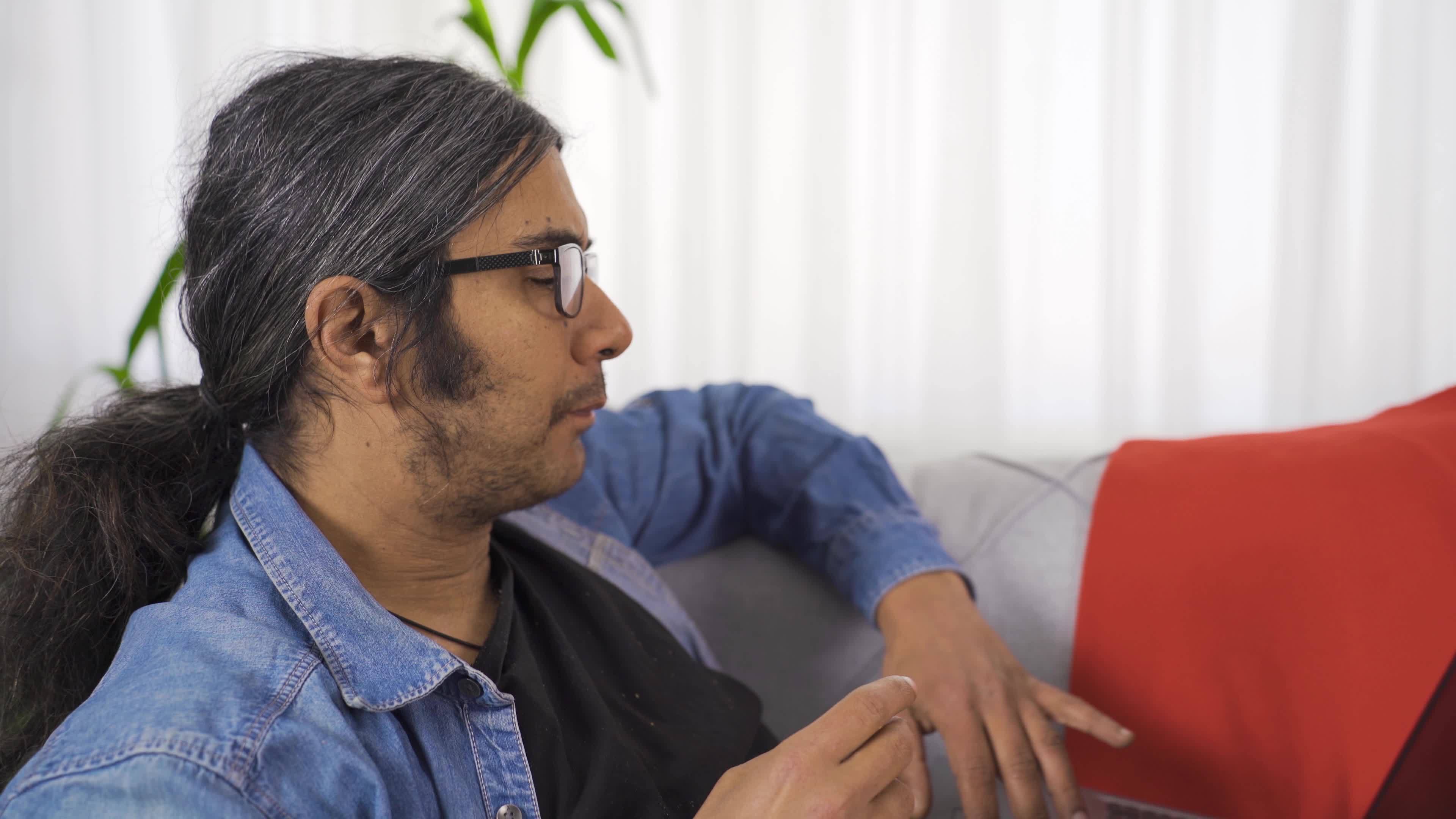 Lazy Man Having Fun At Home Lazy Man Lying On Sofa At Home Eating Chips While Looking At Laptop