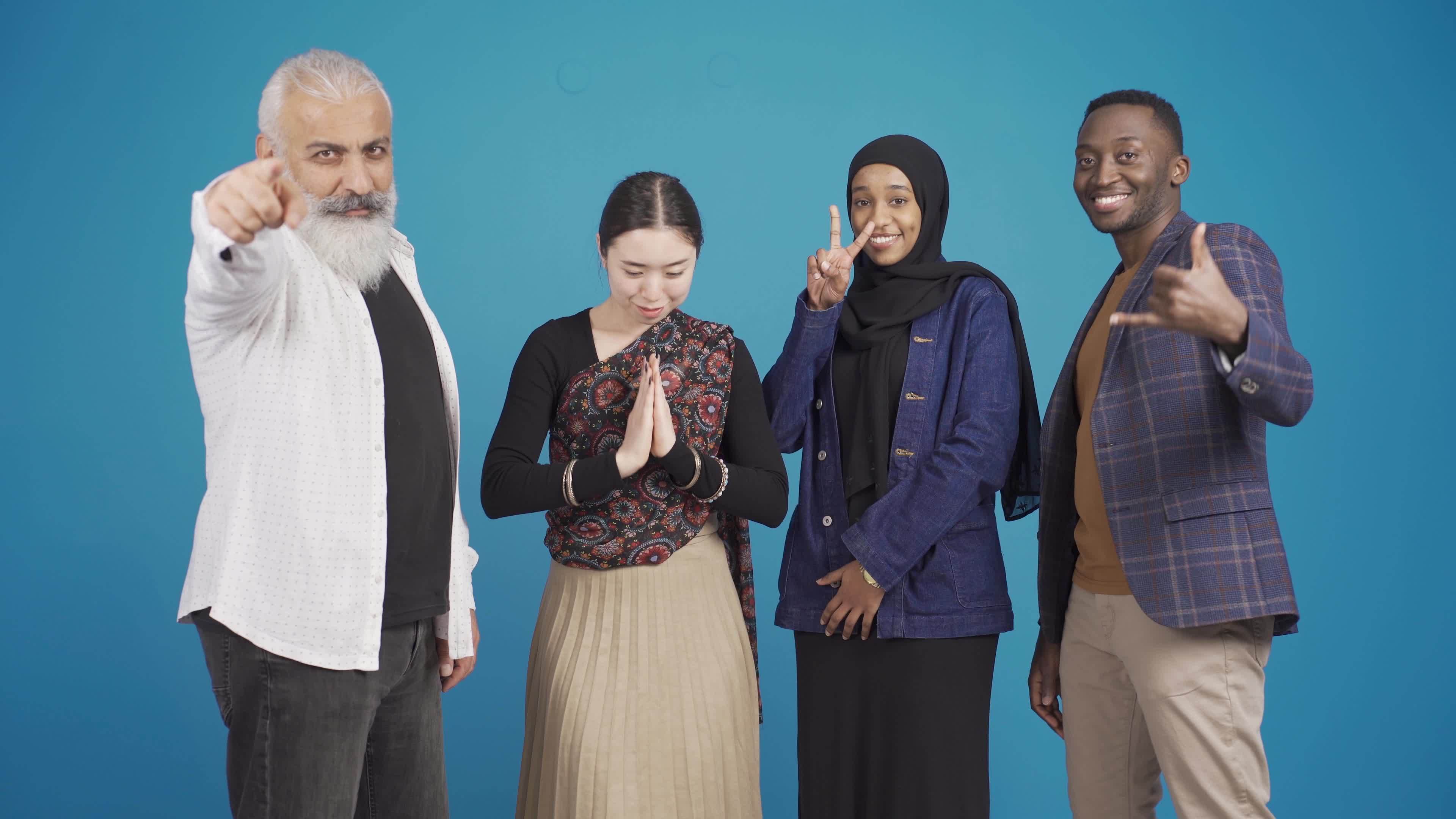Portrait of multiethnic group of friends looking at camera. Close-up portrait of four ...
