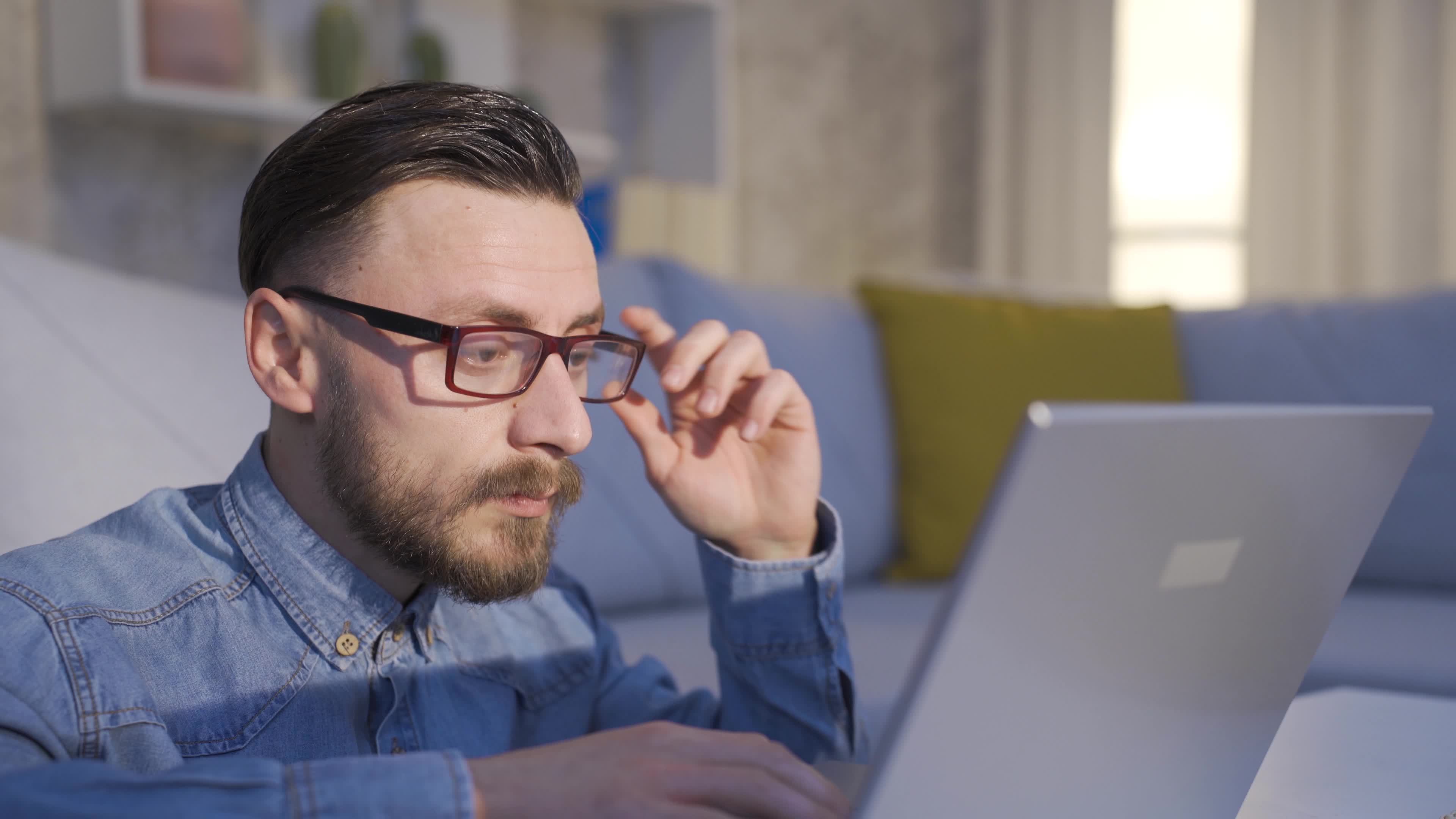 Man looking at computer screen is working very carefully. Senior ...