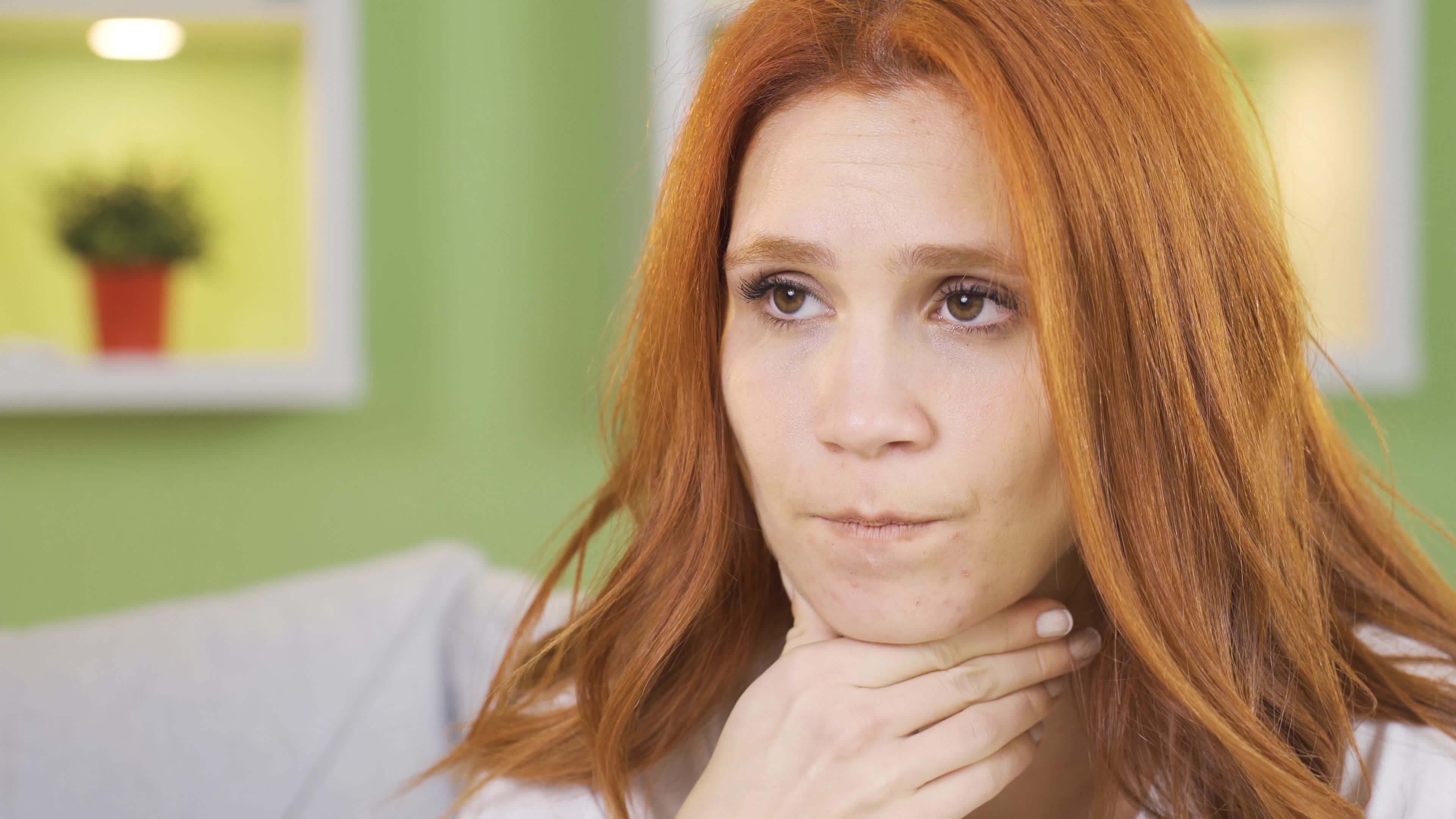 Portrait of thoughtful and unhappy woman in despair. Bored and stressed ...