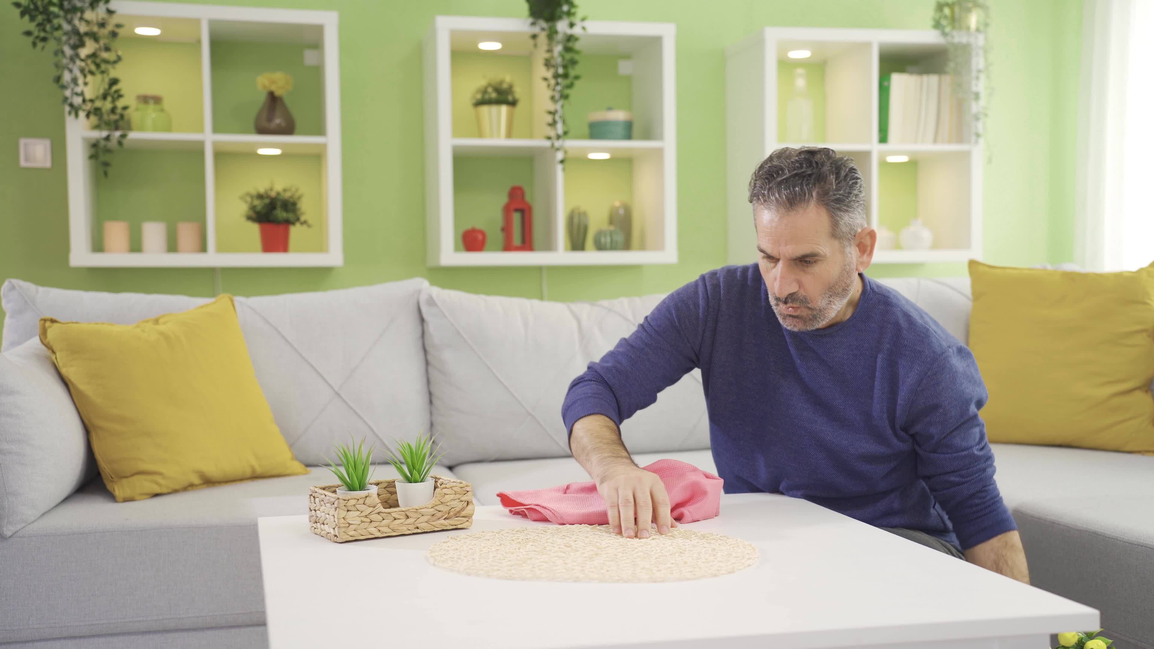 Mature man cleaning house. Cheerful and pleasant mature man doing house ... Mature man cleaning house. Cheerful and pleasant mature man doing house ...