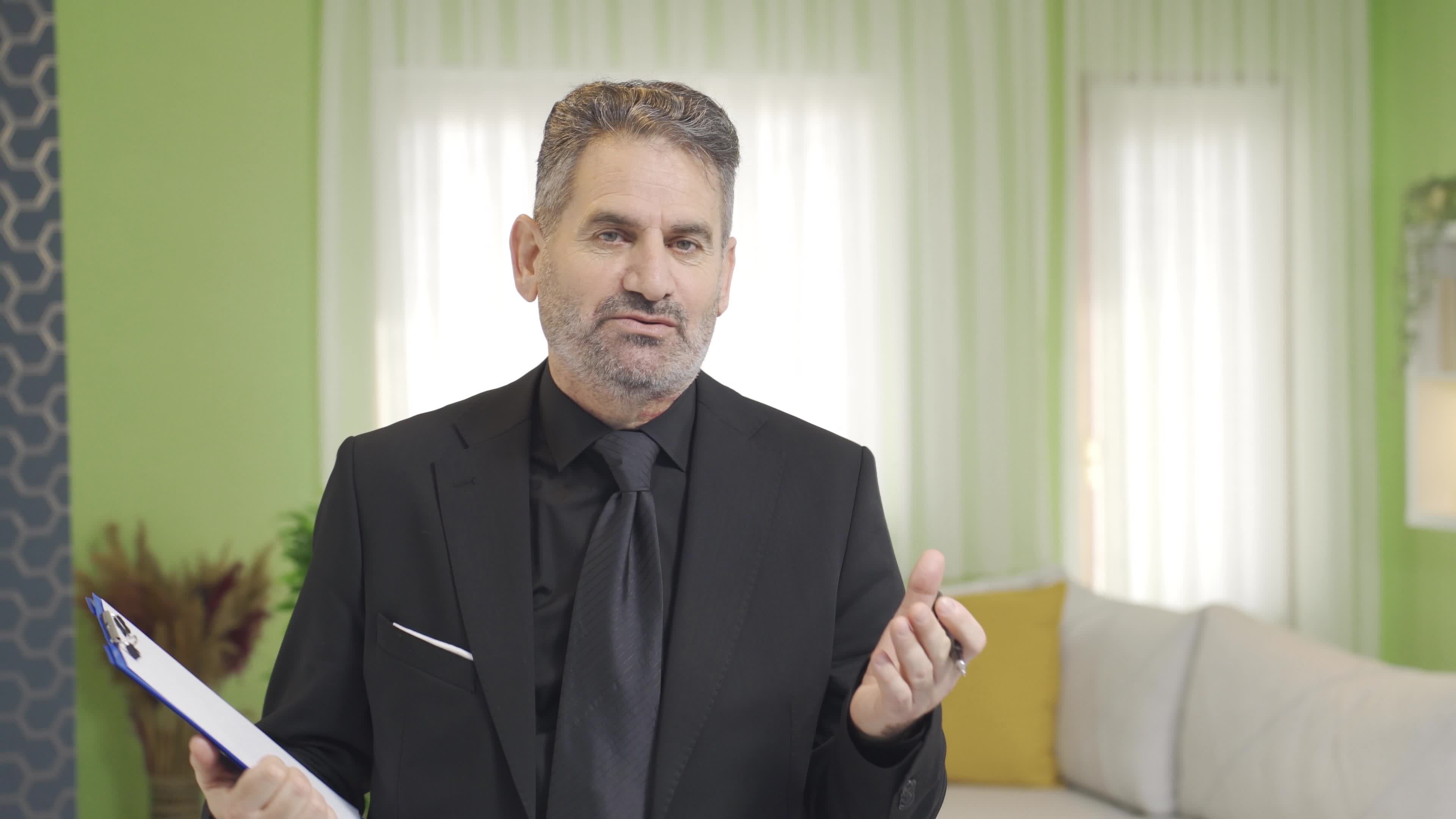 Successful mature businessman practicing for meeting speech ... Successful mature businessman practicing for meeting speech ...