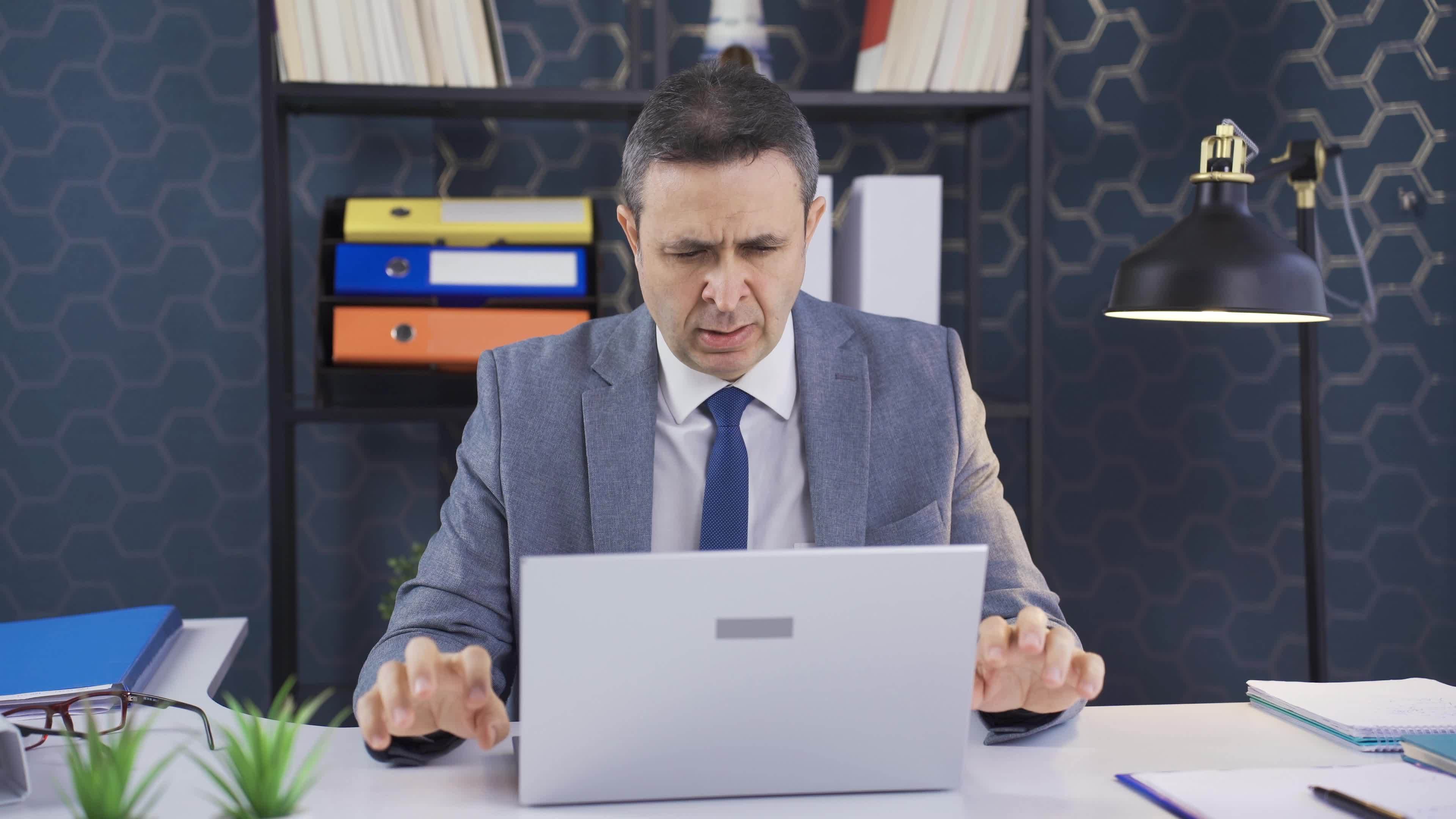 Nervous businessman waiting impatiently by laptop. Waiting for news ... Nervous businessman waiting impatiently by laptop. Waiting for news ...