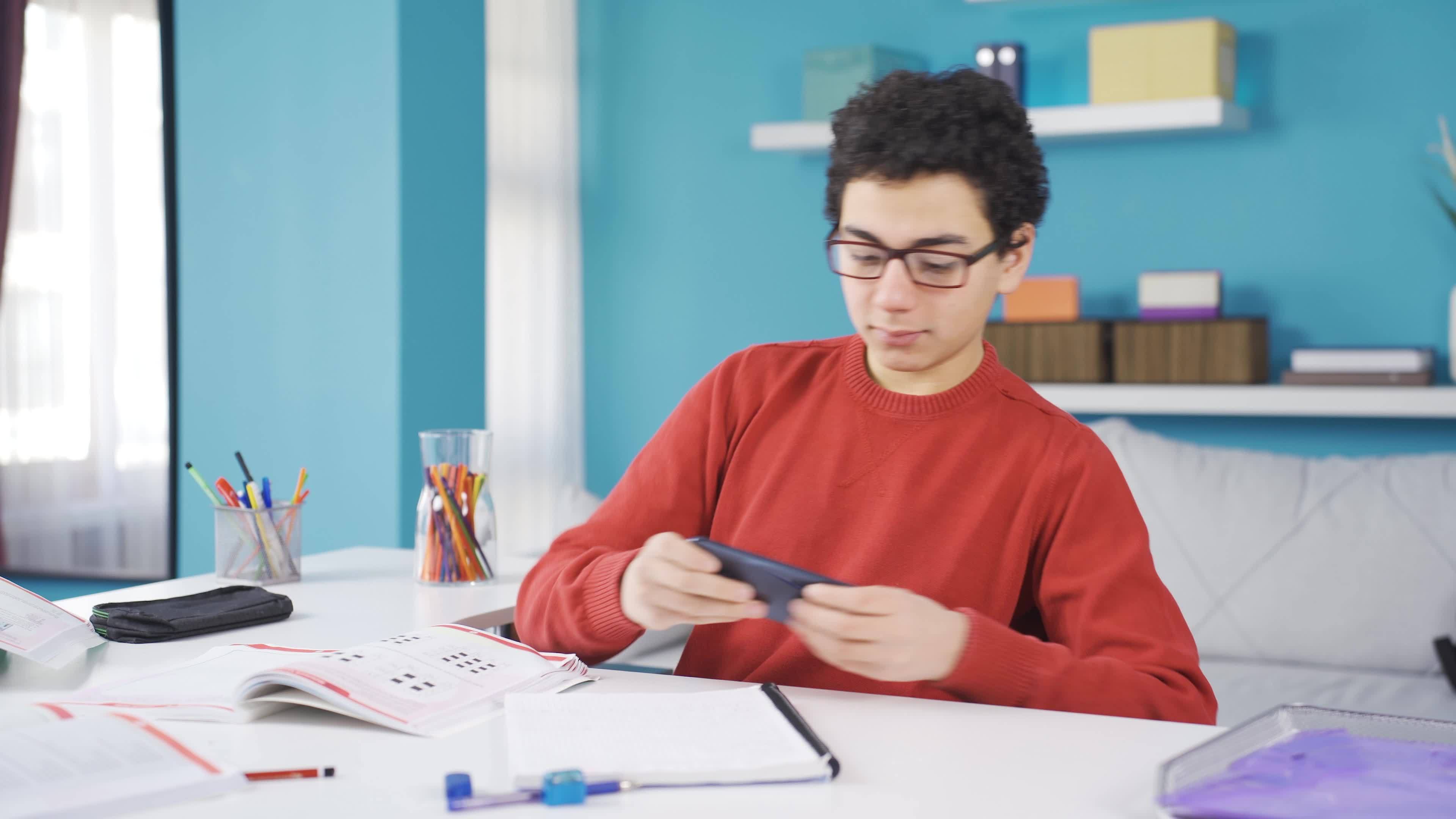 The naughty boy plays on the phone instead of studying, and then he wakes up and studies. The ...