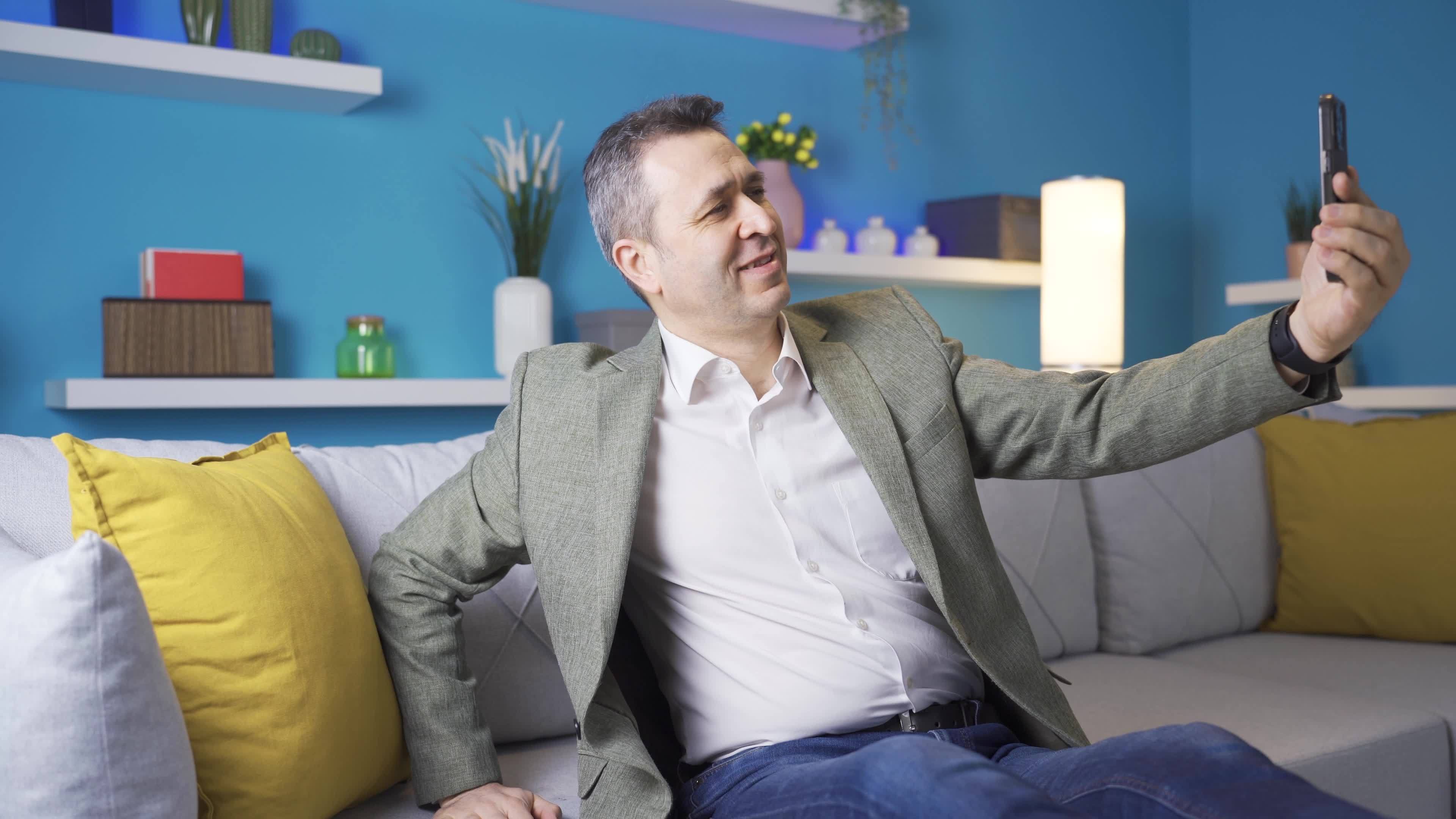 Conceited Mature Man Taking Selfie On Smartphone Alone At Home Man In