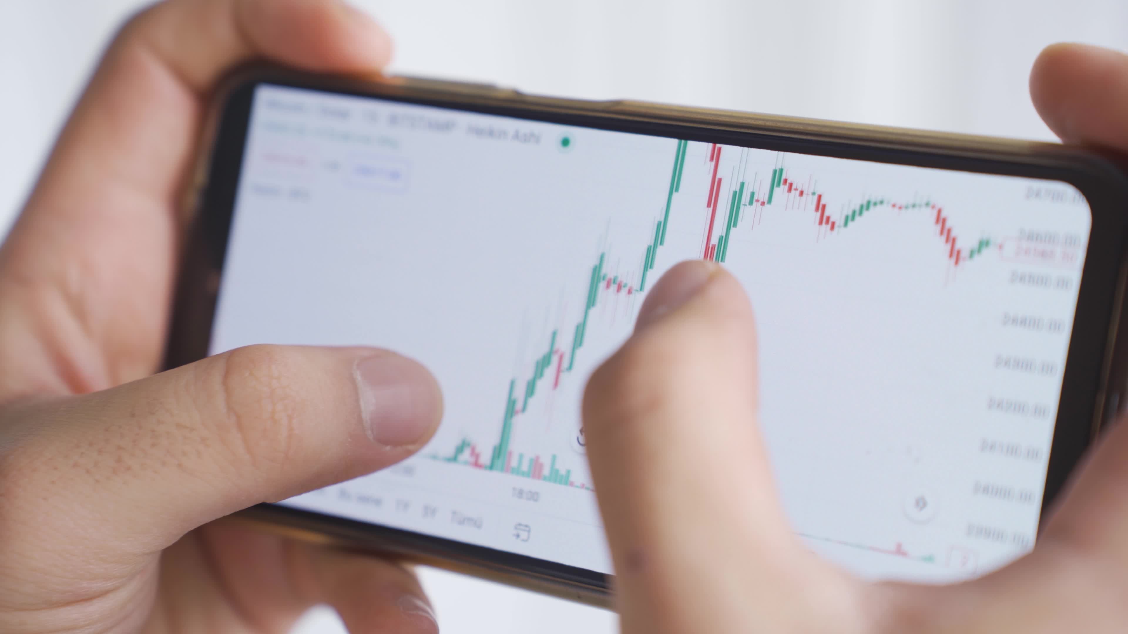 Thoughtful And Experienced Hands Analyzing Charts On The Stock Market