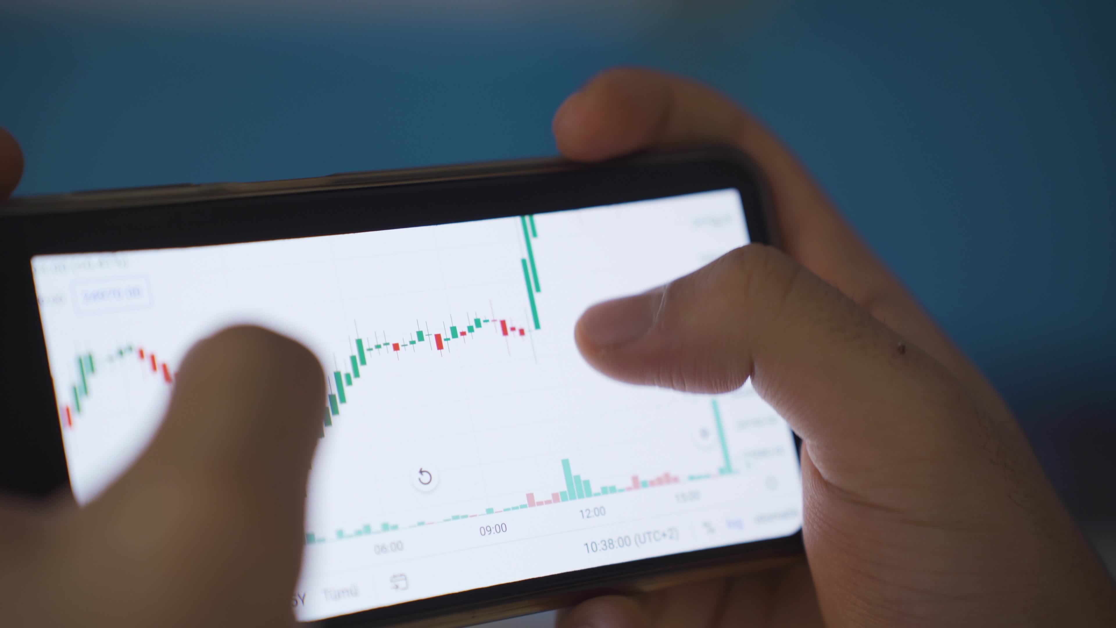 Online Trading, Smartphone Operated Trader by Stock Trading Graph. Man ... Online Trading, Smartphone Operated Trader by Stock Trading Graph. Man ...