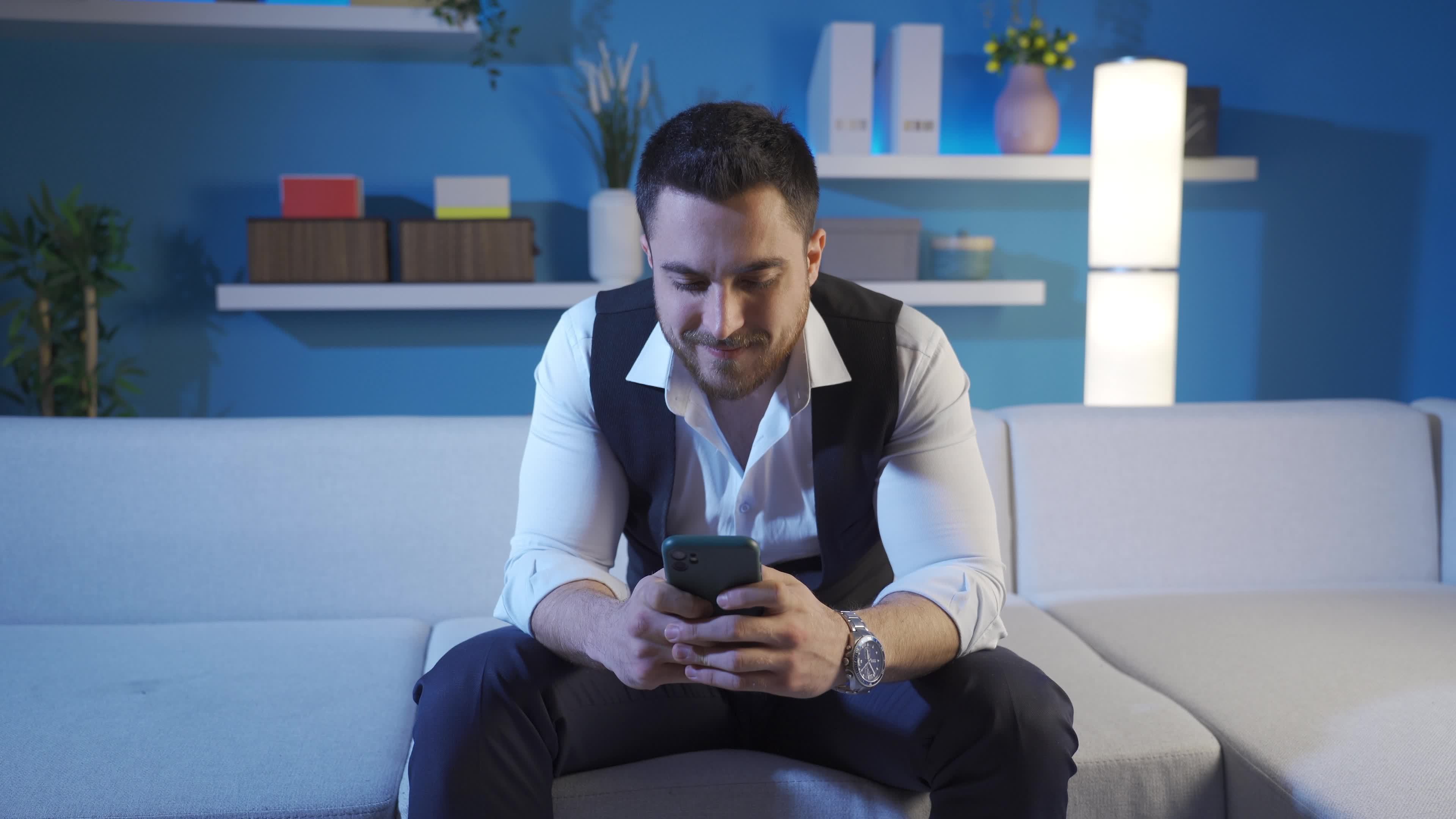Man Sitting In Living Room Texting Late At Night On The Phone Man man-sitting-in-living-room-texting-late-at-night-on-the-phone-man