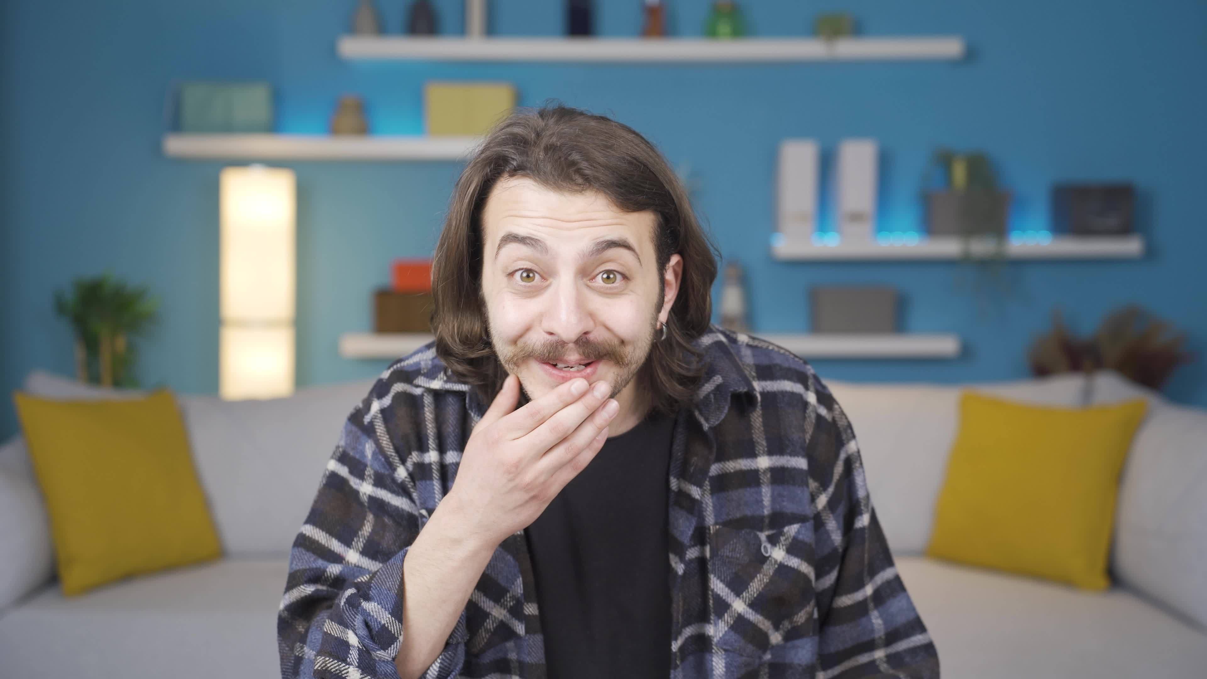 Confused man looking at camera rejoicing. Gestures. The man looking at ... Confused man looking at camera rejoicing. Gestures. The man looking at ...