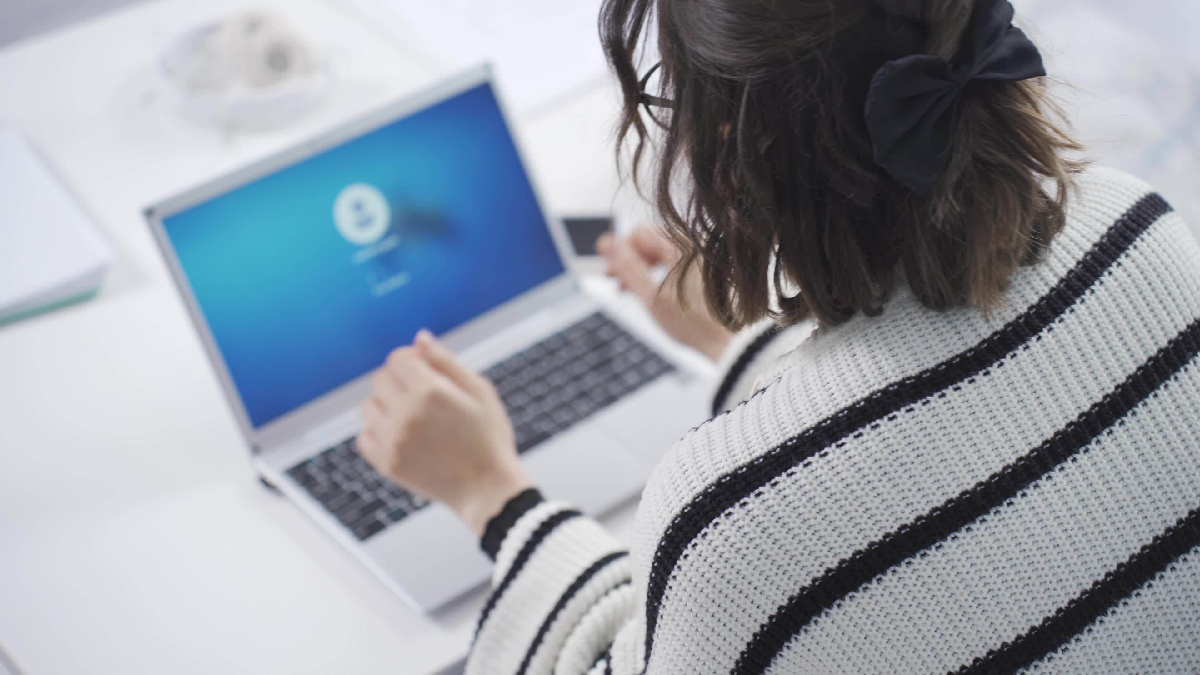 Woman Entering Password The Computer Turns On The Woman Who Enters