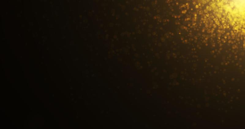 Golden luxury bokeh on particles floating in the air. Dust and glitter particles background ...