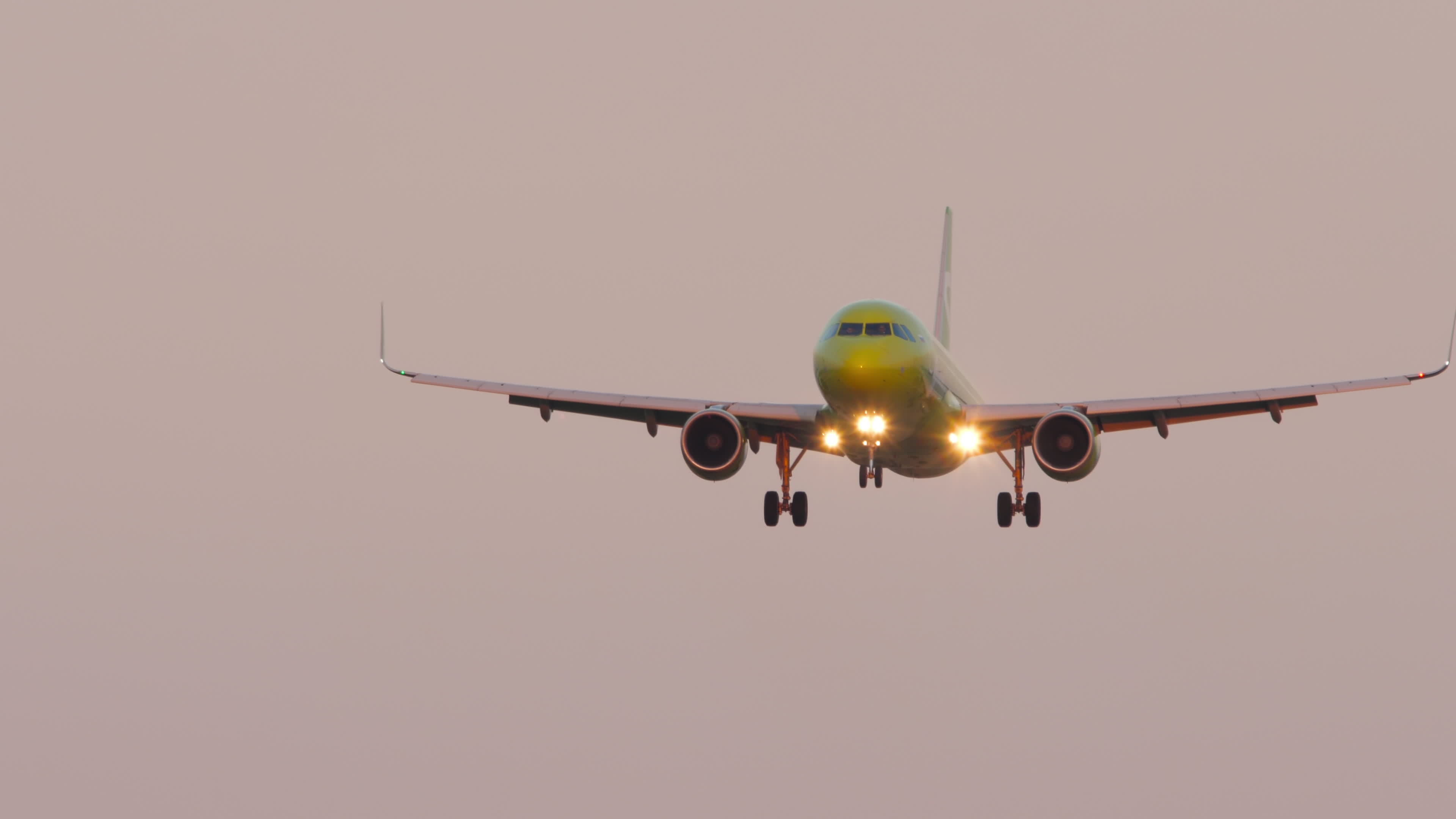 Cinematic shot of aircraft flies. Front view long shot of jet plane ... Cinematic shot of aircraft flies. Front view long shot of jet plane ...