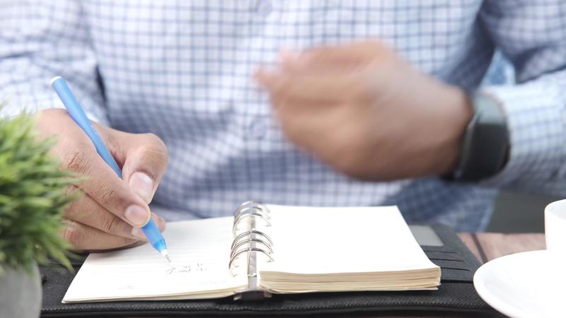 Close up of man hand writing on notepad 22949921 Stock Video at Vecteezy