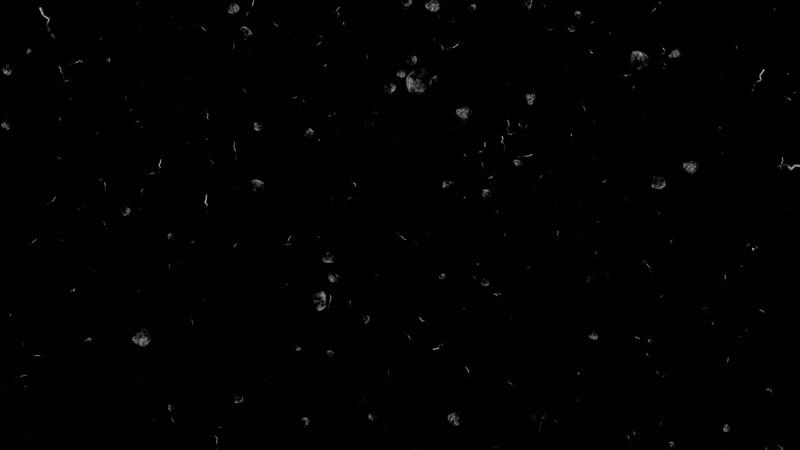 White ash or dust particles, flying and floating on air in a loop, overlay a black background ...