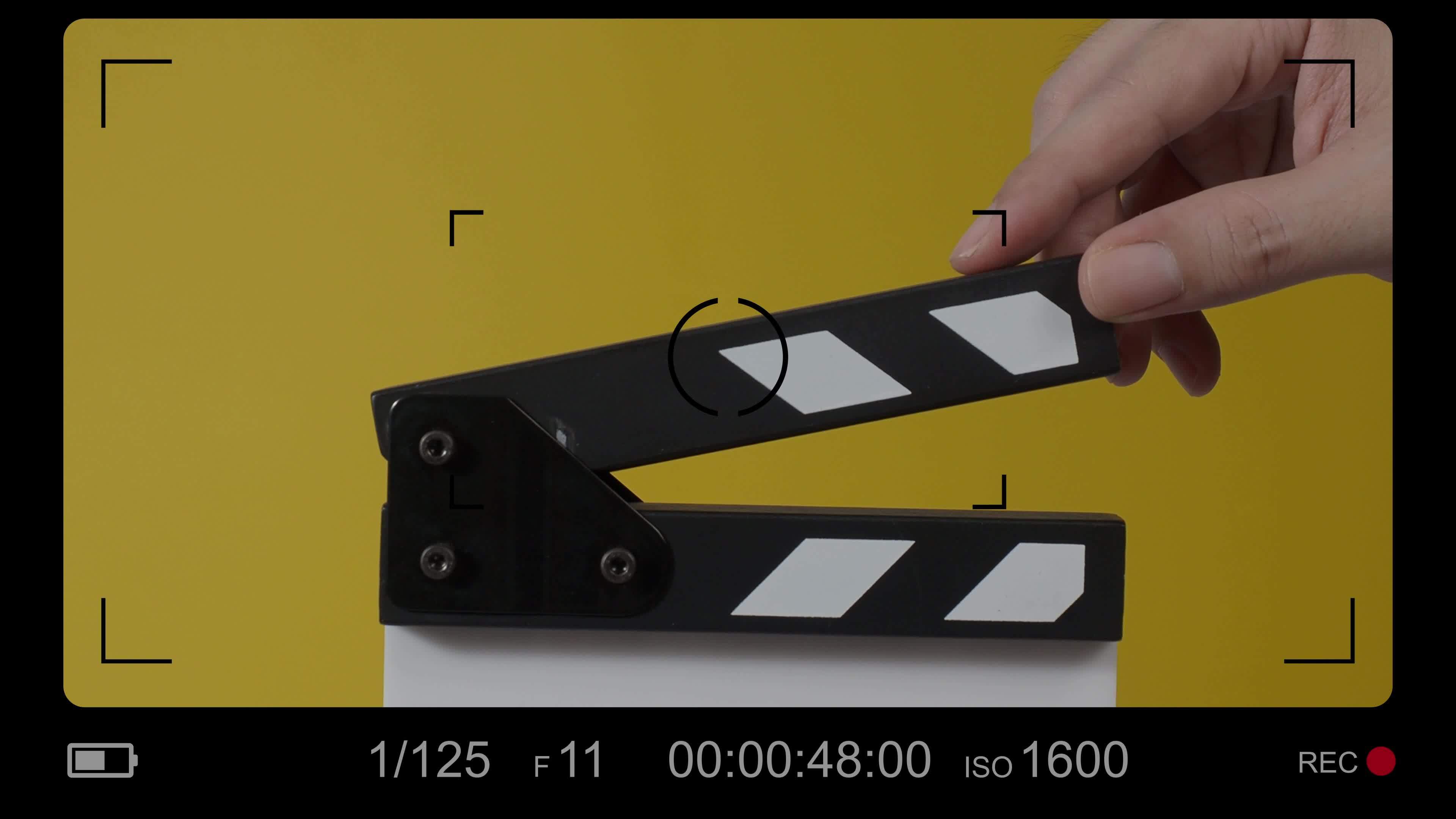 Film Slate Or Movie Clapperboard Hitting In Front Of Cinema Camera film-slate-or-movie-clapperboard-hitting-in-front-of-cinema-camera