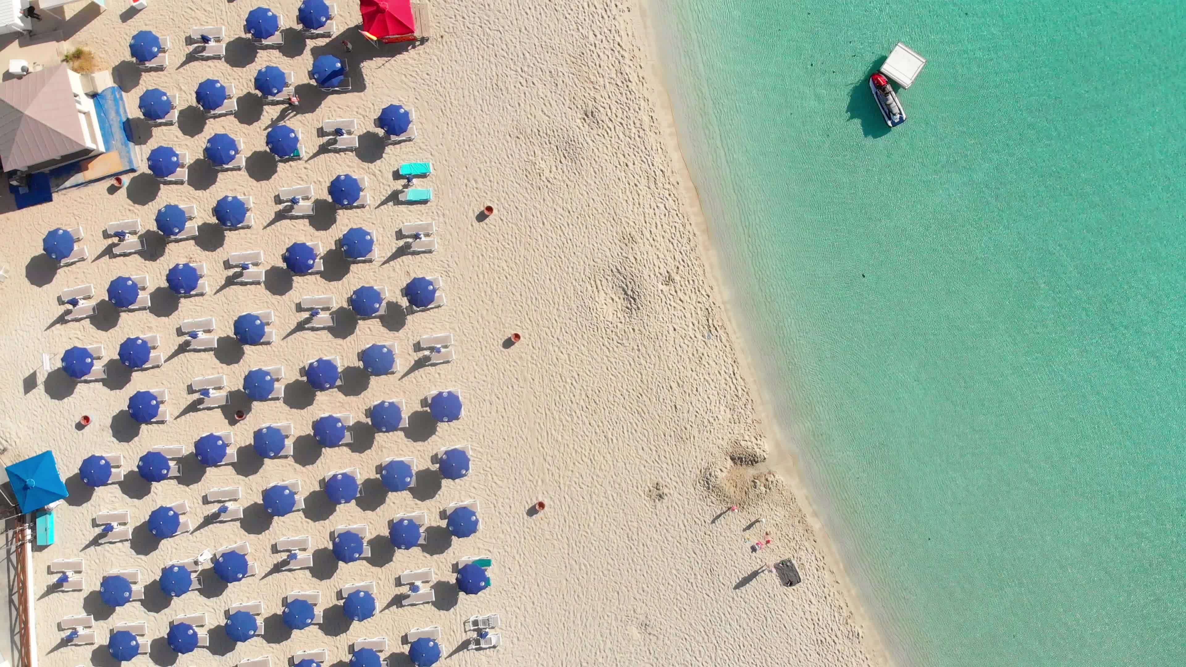 Aerial View from Above over famous Nissi Beach in Cyprus. Nissi Beach with sunbeds and umbrellas ...