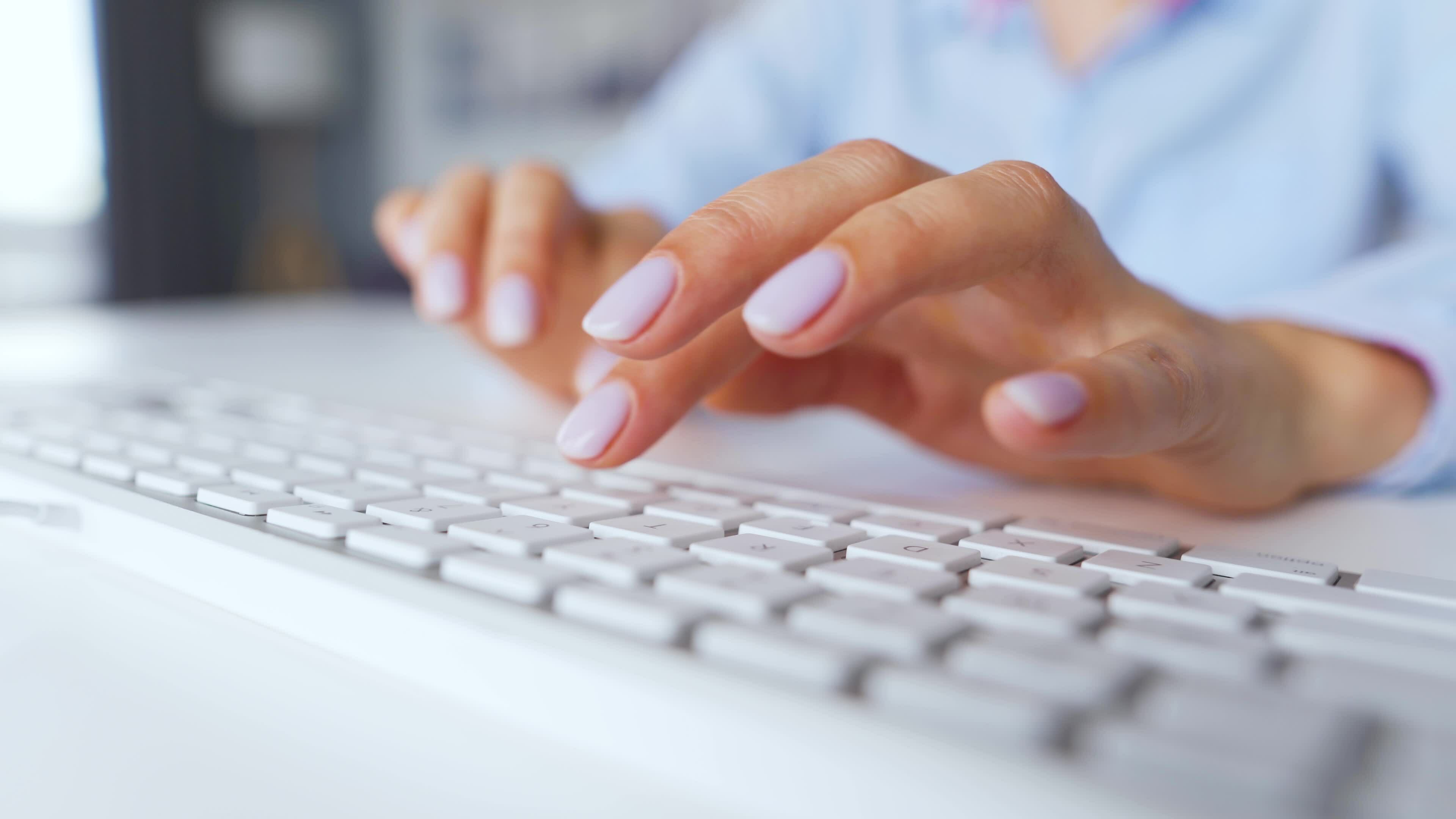 Female hands typing on a computer keyboard. Concept of remote work ...