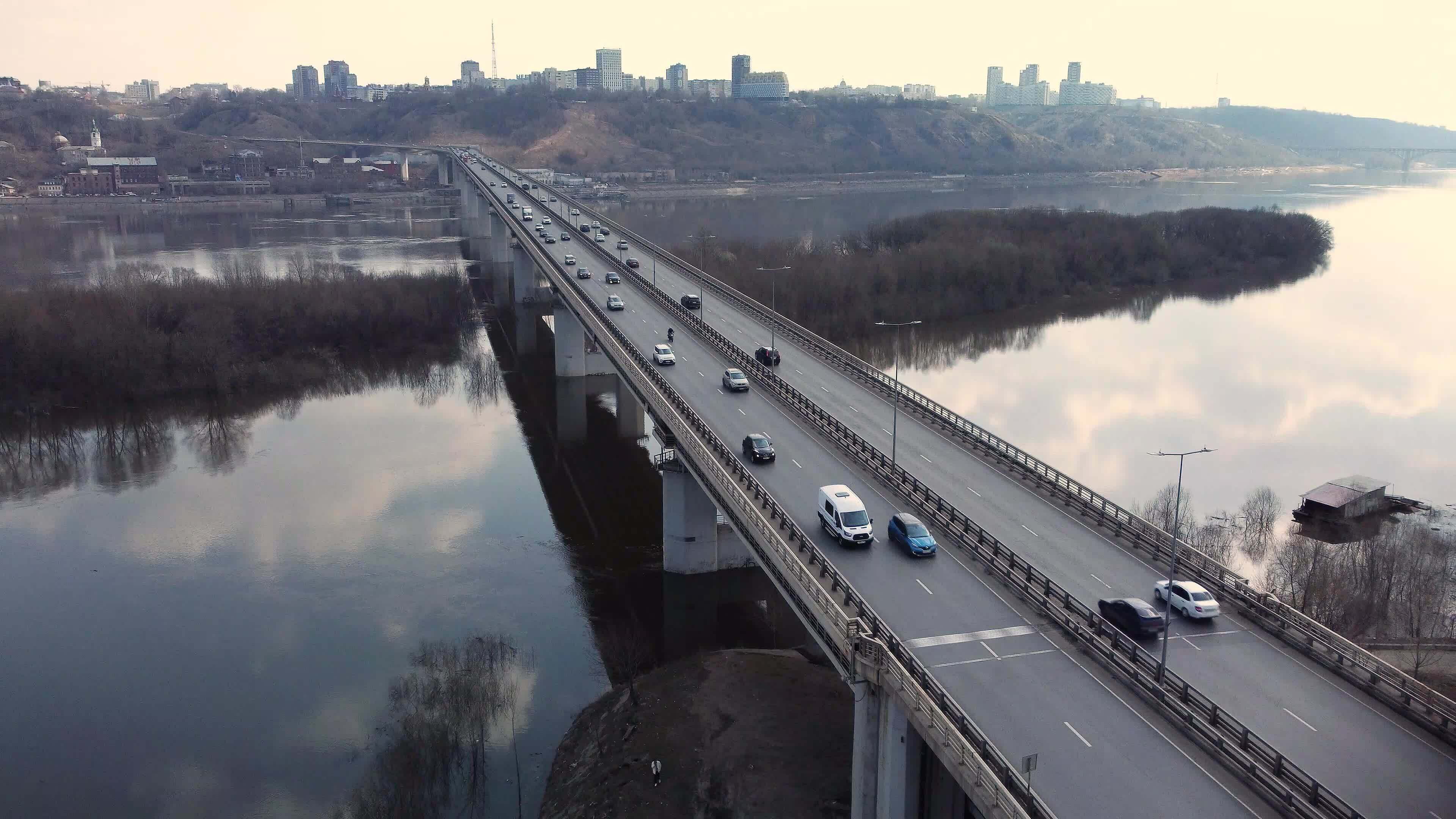 A road bridge over the river, taken from a quadrocopter. 23583840 Stock Video at Vecteezy