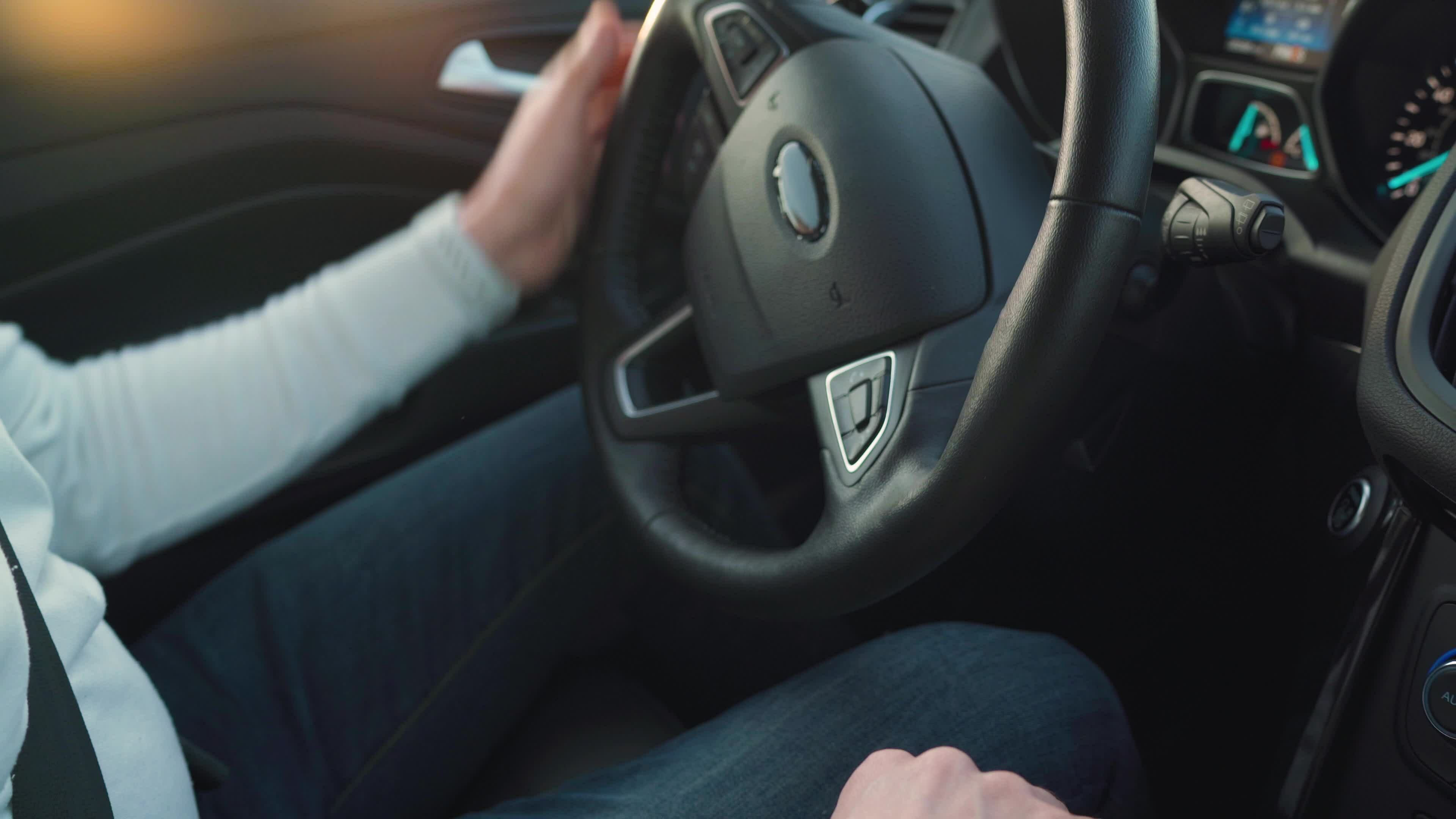 Man driving in innovative automated car using lane holding function ...