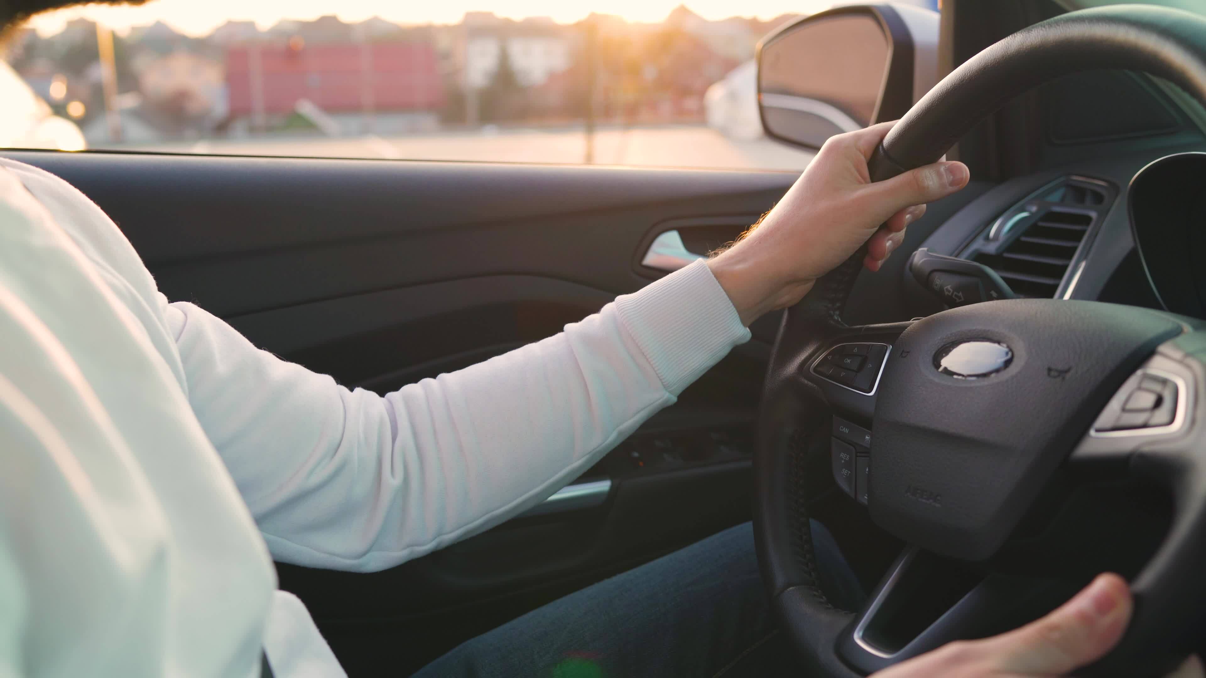 Man driving in innovative automated car using lane holding function ... Man driving in innovative automated car using lane holding function ...