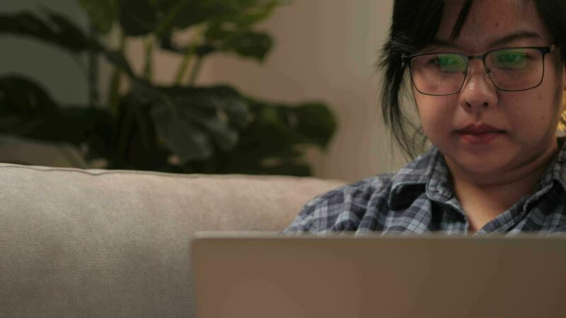 Footage of young Asian woman, freelance data scientist work remotely at ...