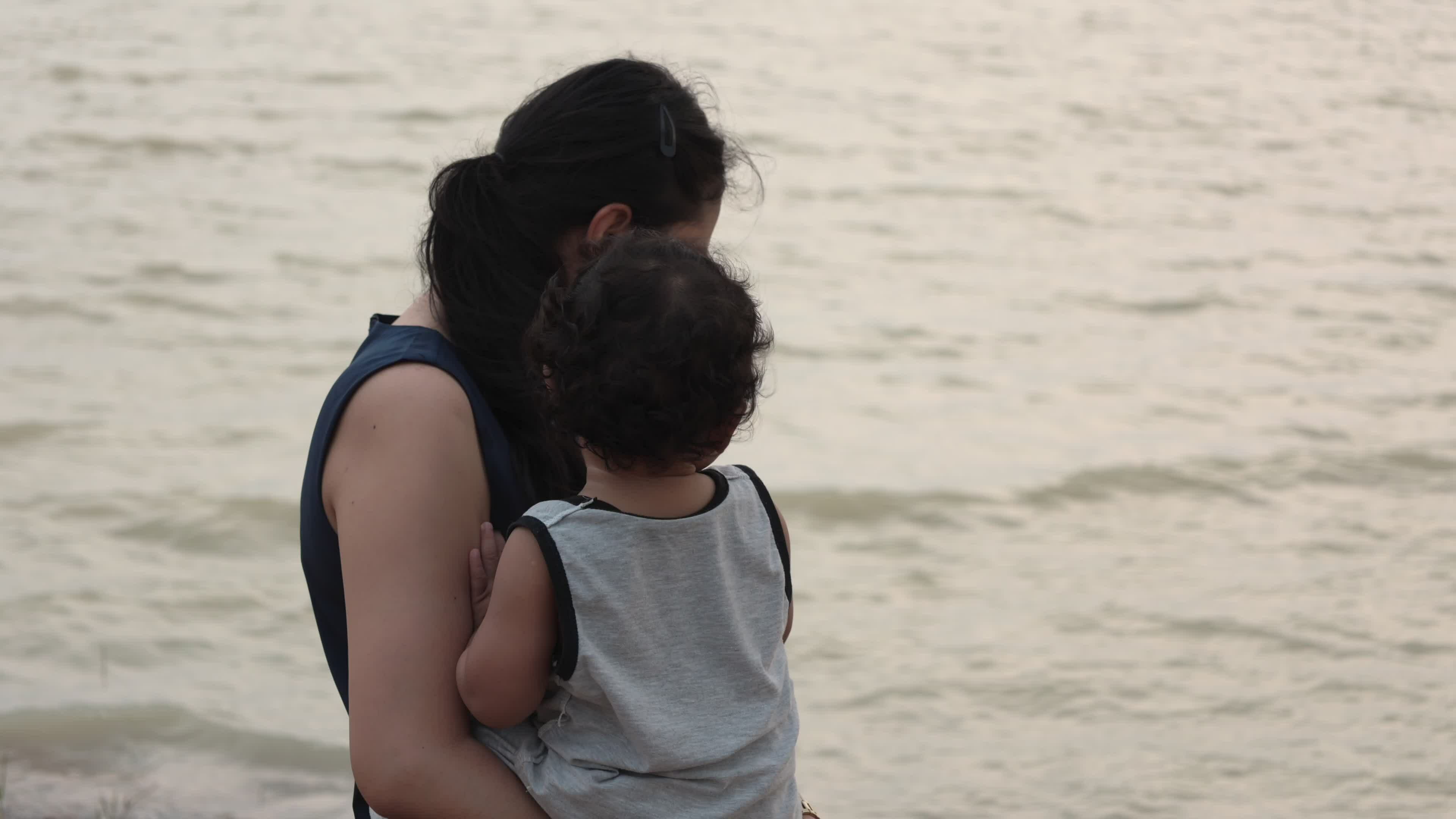 Family happy, Mother and baby doing outdoor activities on the shore of ...