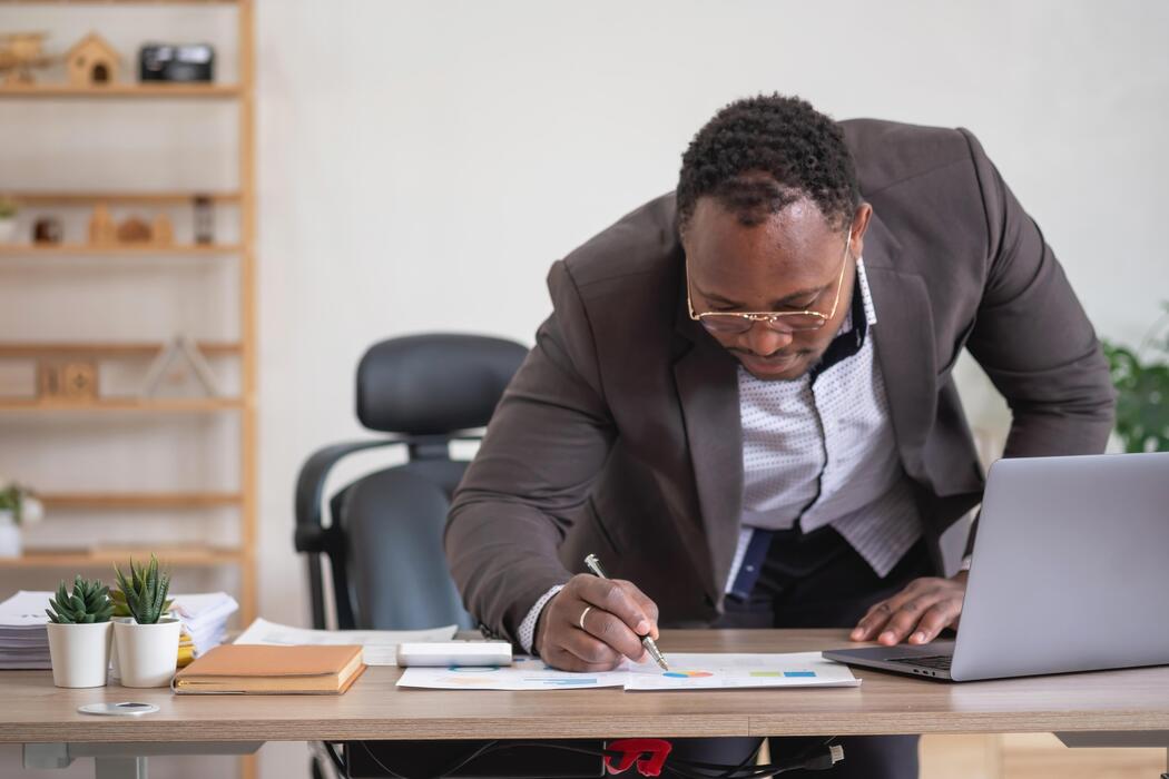 Man Working On Desk Stock Photos, Images and Backgrounds for Free Download