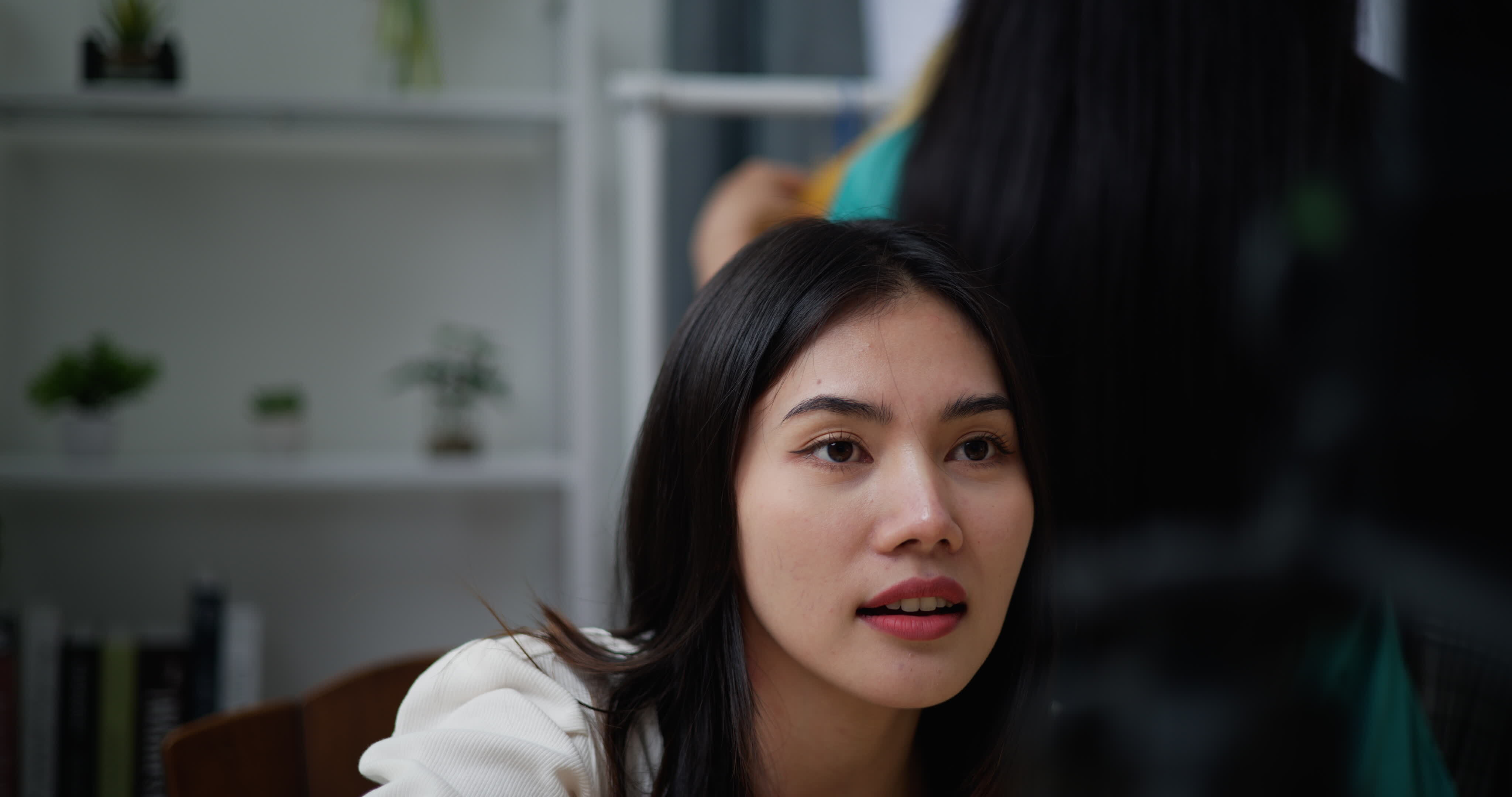 Footage close up shot of Young Beautiful Asian women live streaming to sale new fashion clothes ...