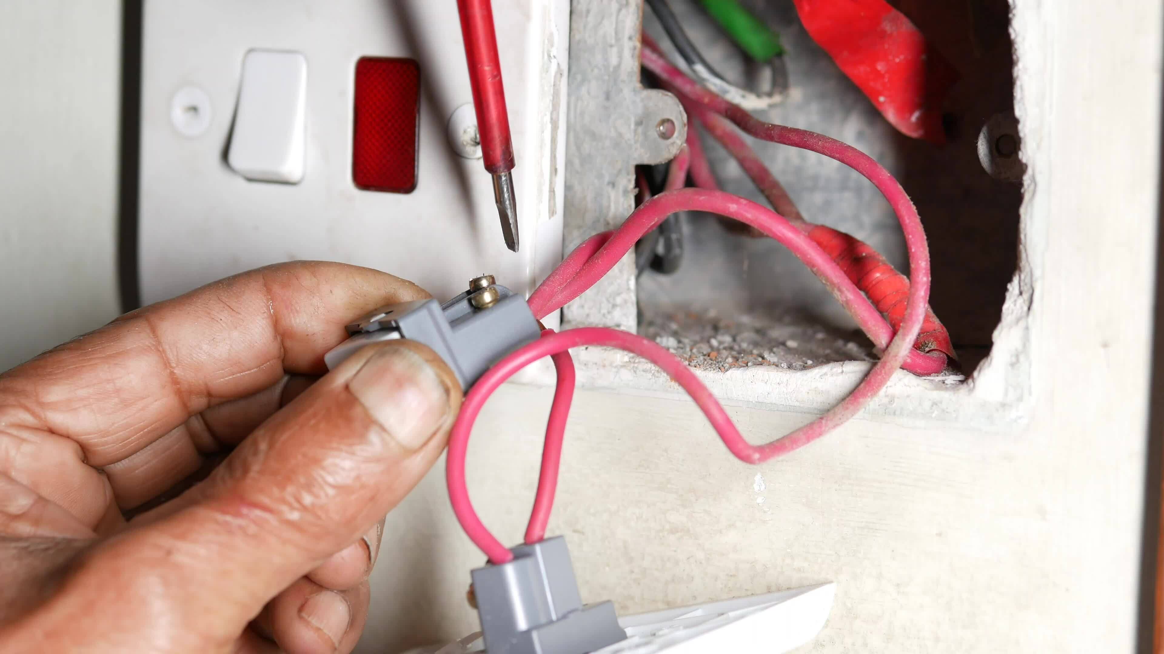 Electrician installing light switch in home 24216767 Stock Video at ... Electrician installing light switch in home 24216767 Stock Video at ...