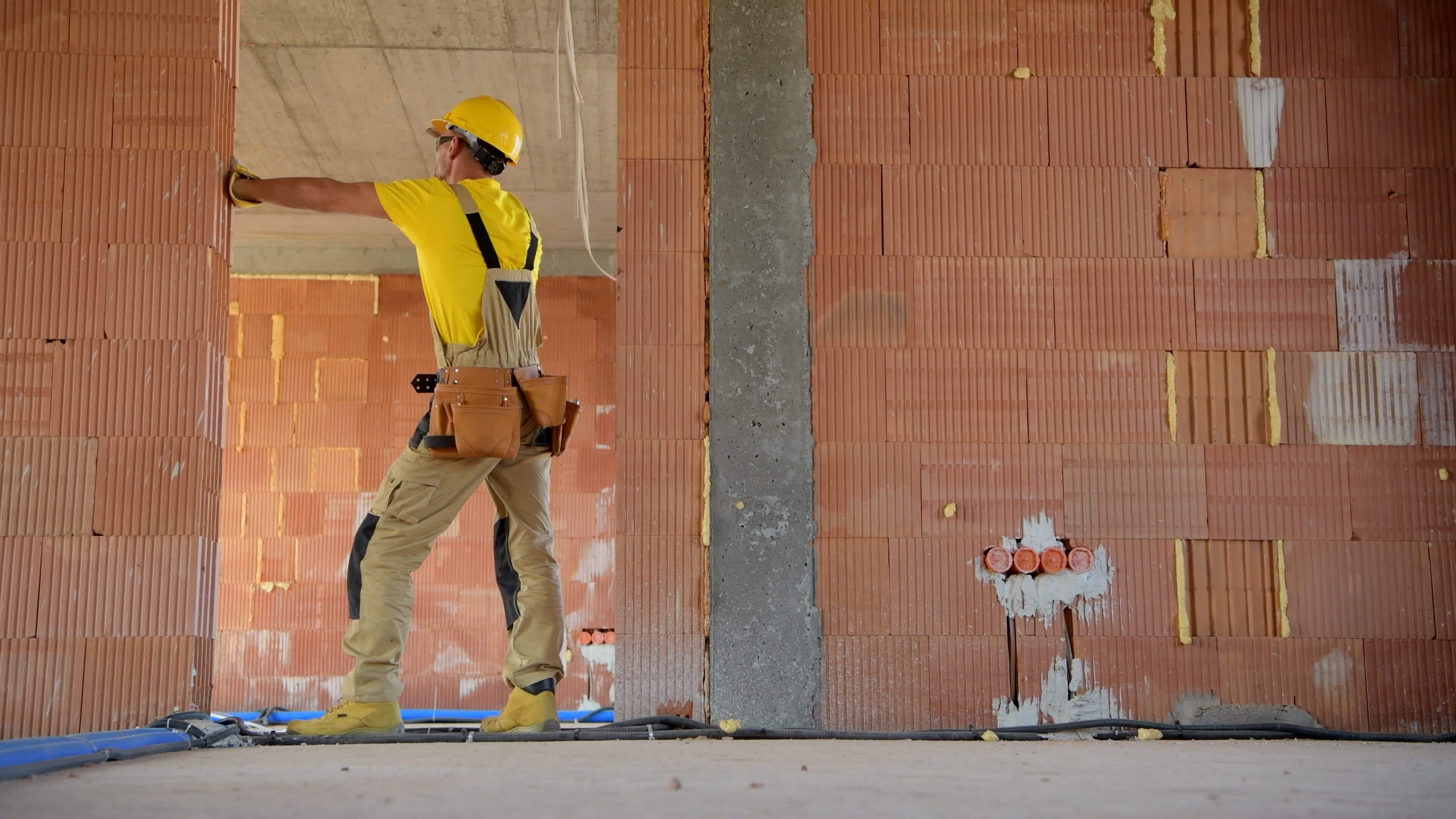 Caucasian Construction Contractor Inside Concrete Blocks Built Building ... Caucasian Construction Contractor Inside Concrete Blocks Built Building ...