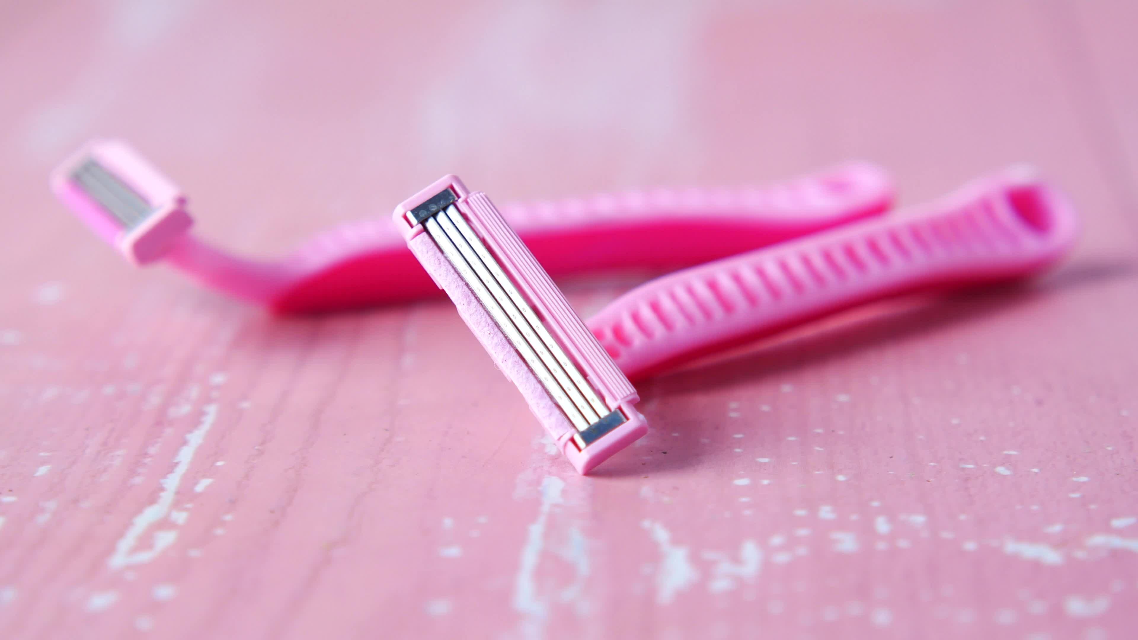Close up of pink color razor on table 24694282 Stock Video at Vecteezy